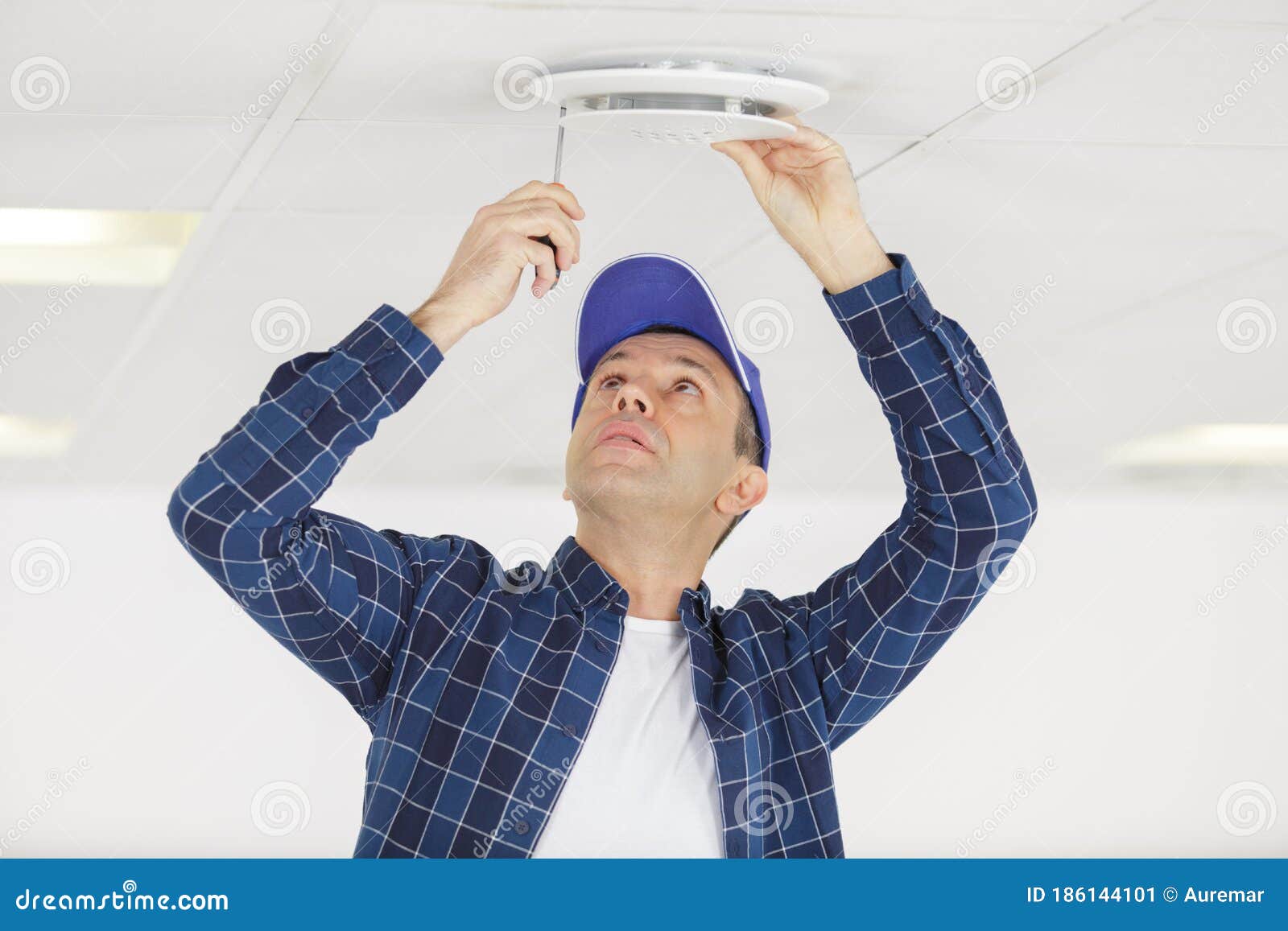 Mature Man Installing Ventilation Grill in Ceiling Stock Image - Image ...
