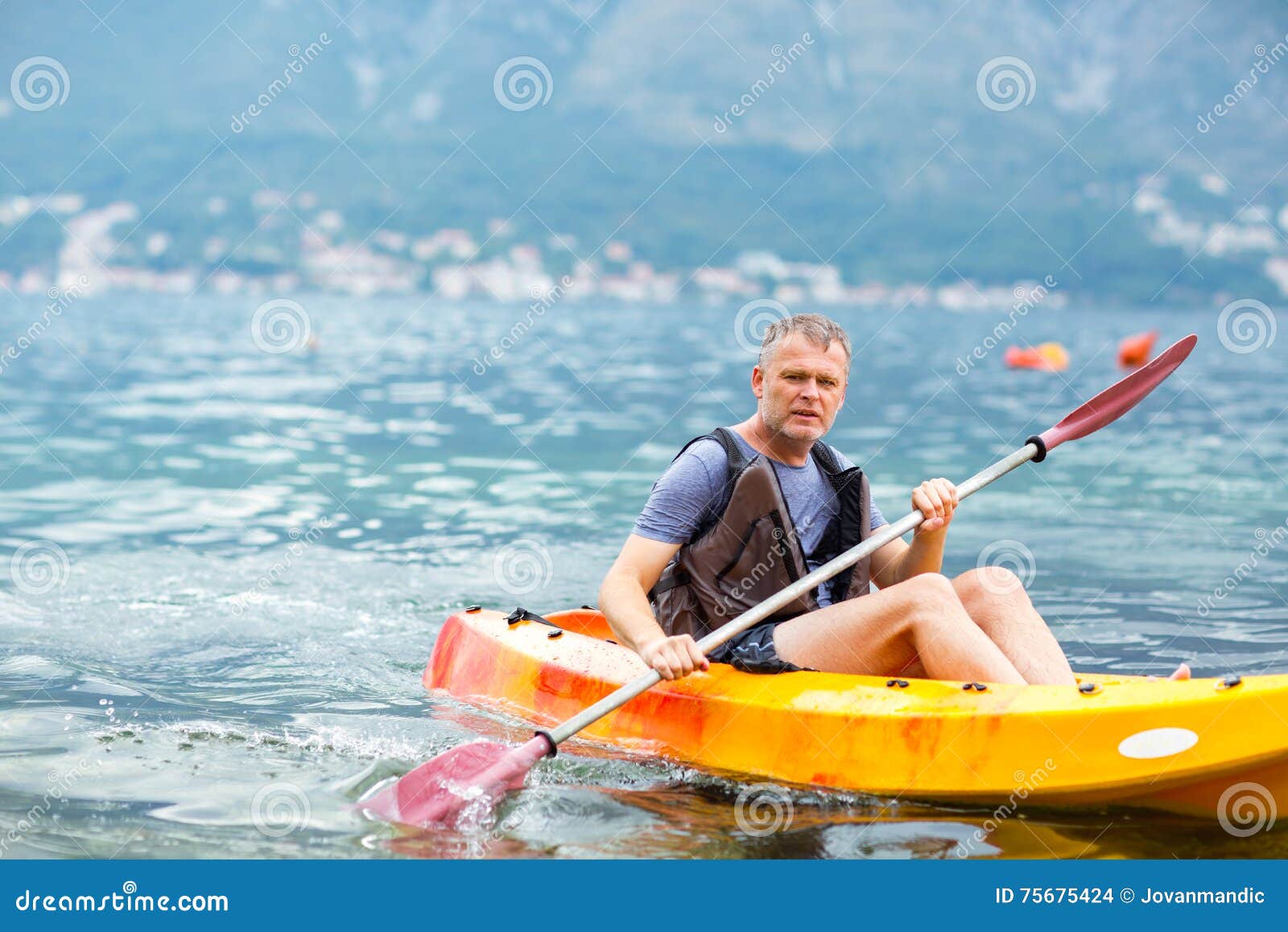 Mature Man Kayaking on the Sea Stock Photo - Image of happy, mature ...