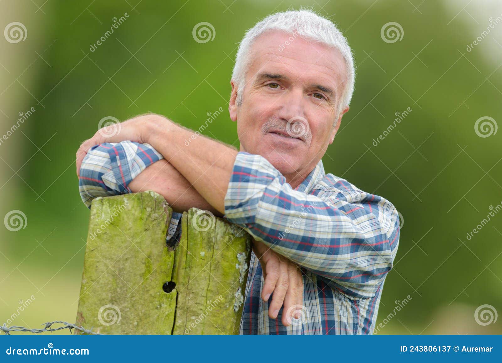Mature man leaning on post stock image. Image of outdoors - 243806137