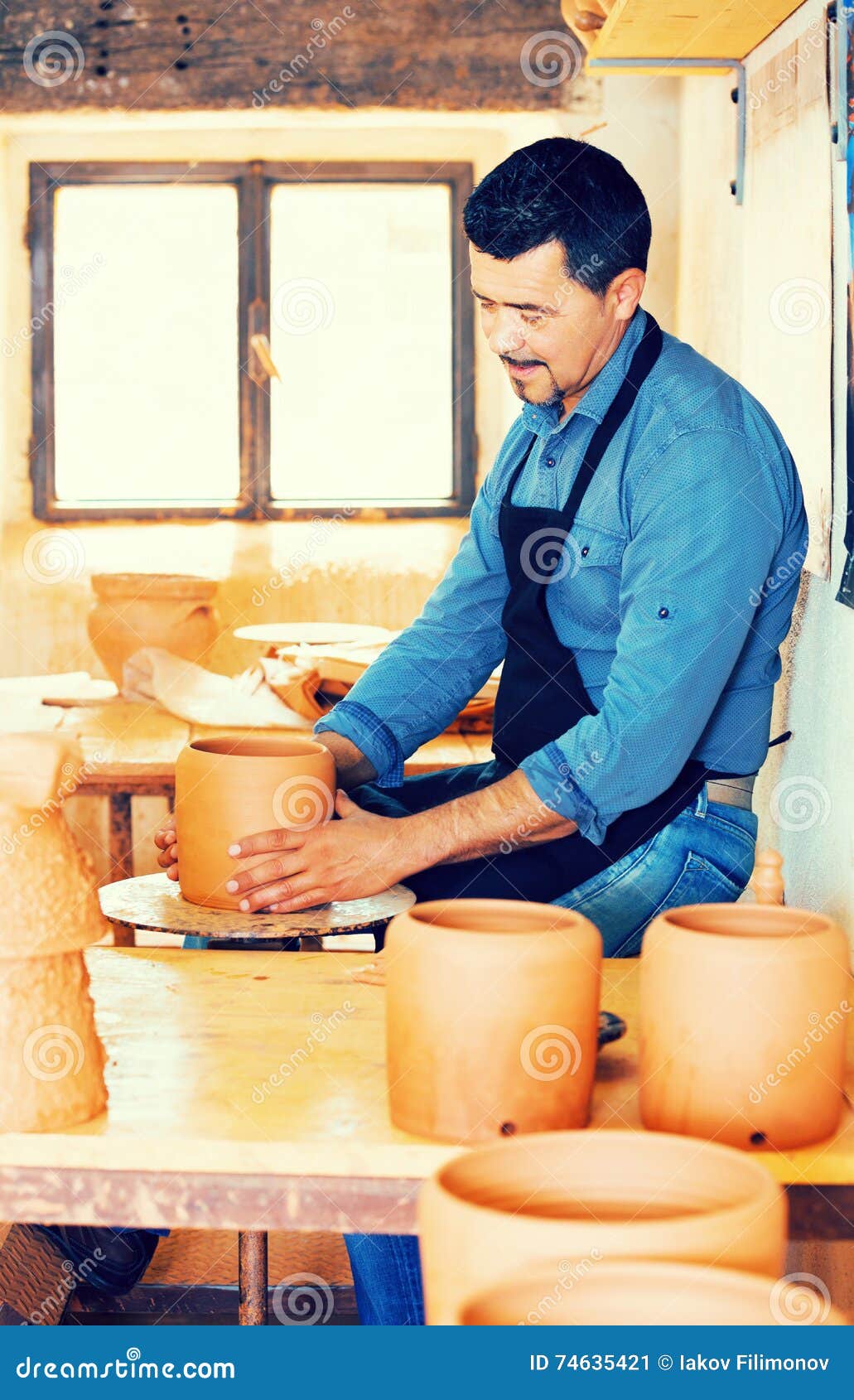 Mature man making pot stock image. Image of production - 74635421