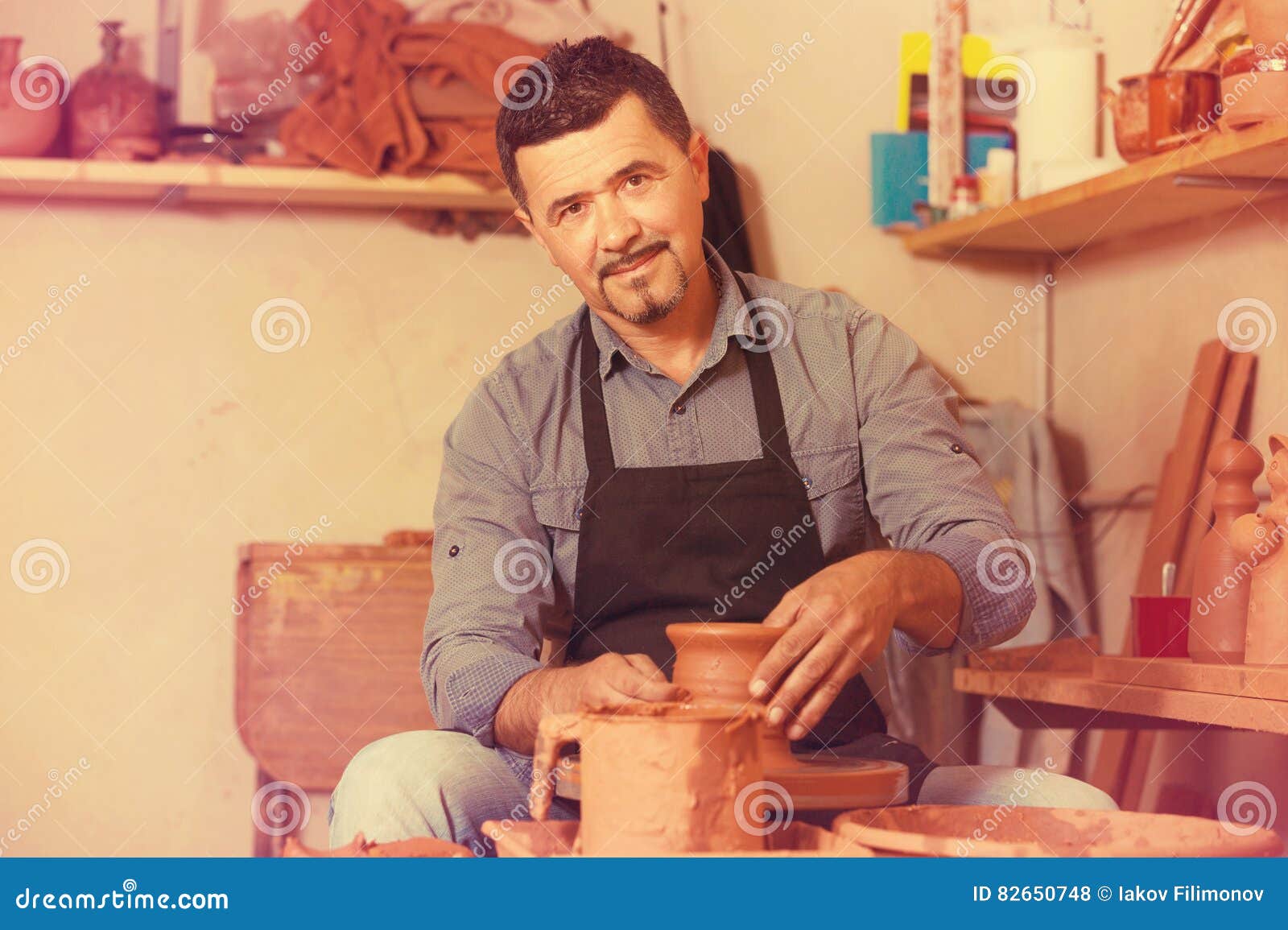 Mature man making pot stock photo. Image of craft, manual - 82650748