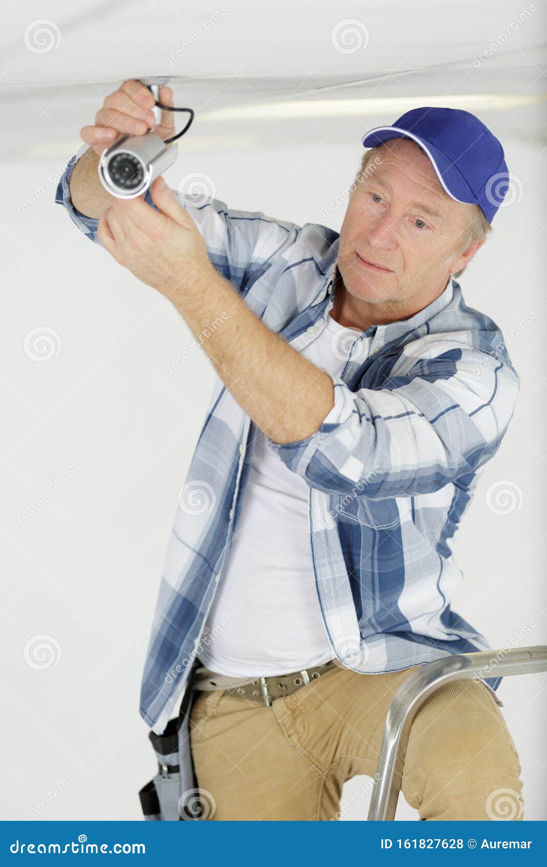Mature Man Mounting Cctv Camera Stock Photo - Image of monitoring ...