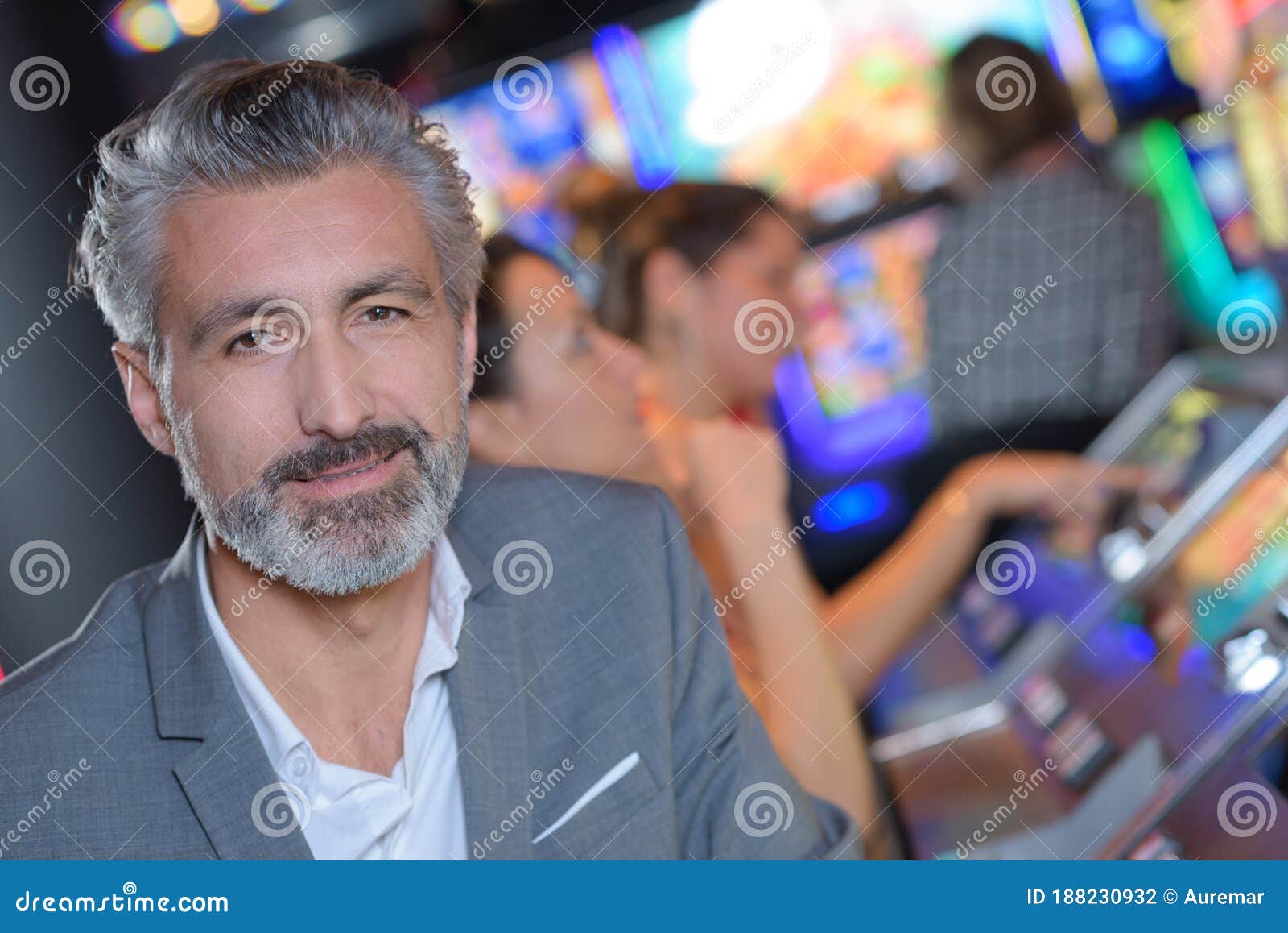 Mature Man Playing Slot Machine Stock Photo - Image of game, alone ...