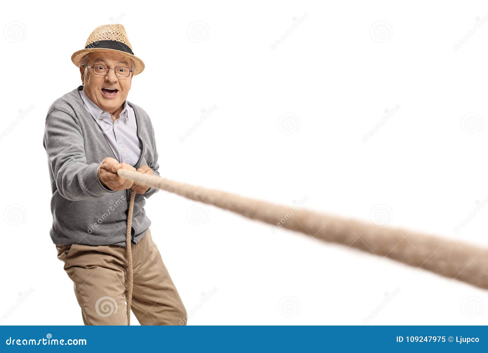 Mature man pulling a rope stock image. Image of background - 109247975