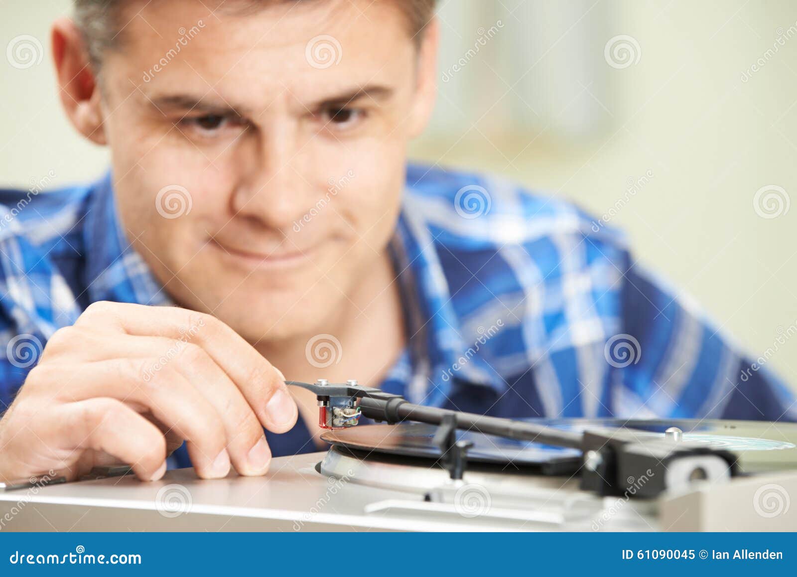 Mature Man Putting Vinyl Record on Player Stock Image - Image of ...