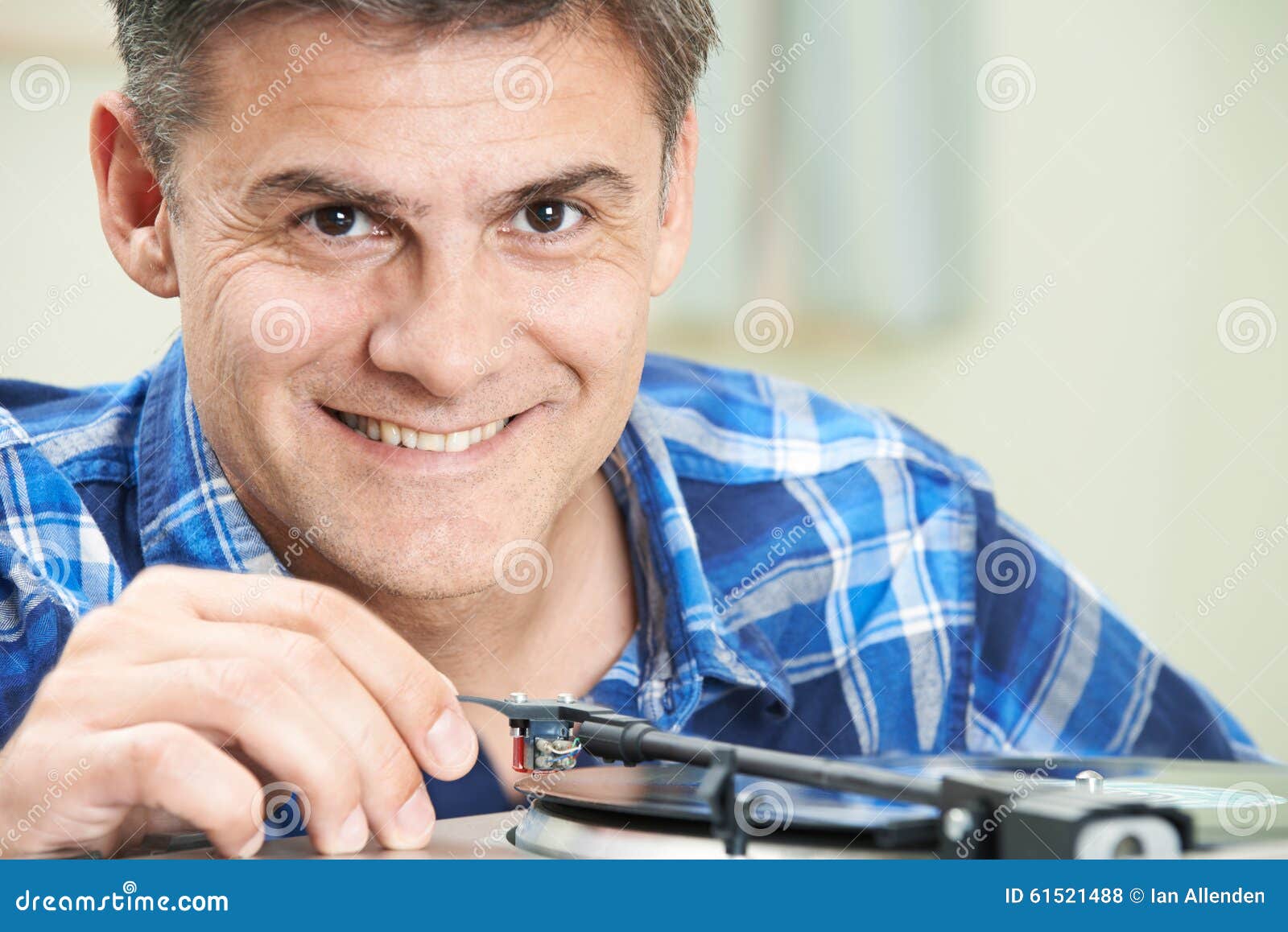 Mature Man Putting Vinyl Record on Player Stock Photo - Image of ...