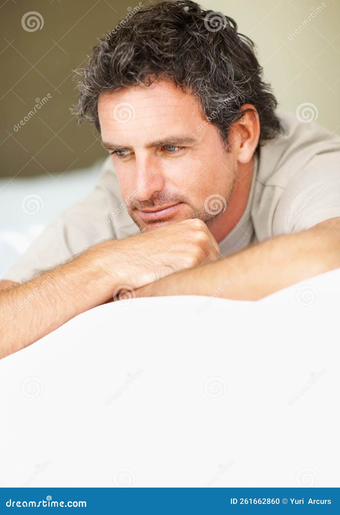 Mature Man Relaxing on Bed. Thoughtful Mature Man Relaxing on Bed ...