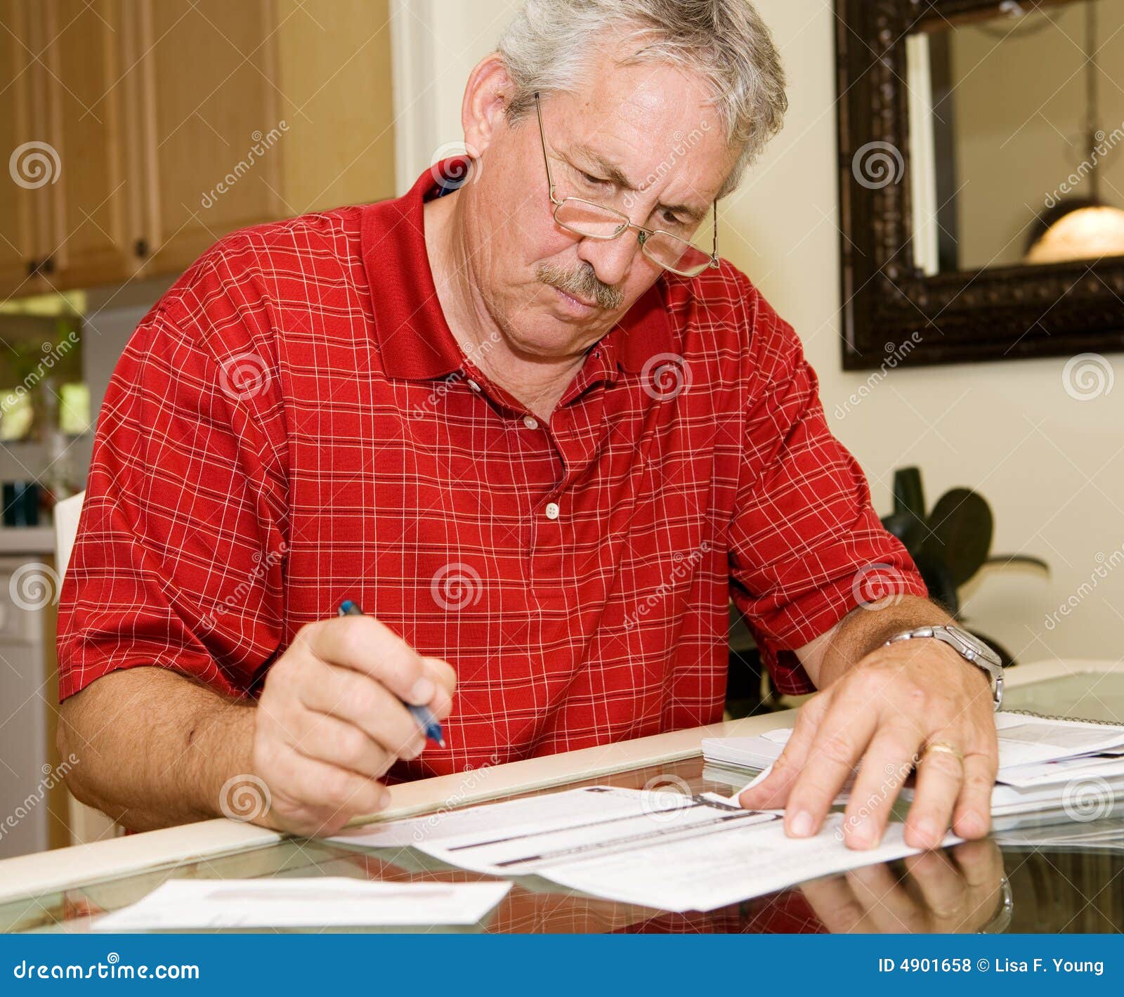 Mature Man Signing Papers stock photo. Image of fifty - 4901658