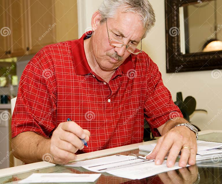 Mature Man Signing Papers stock photo. Image of fifty - 4901658