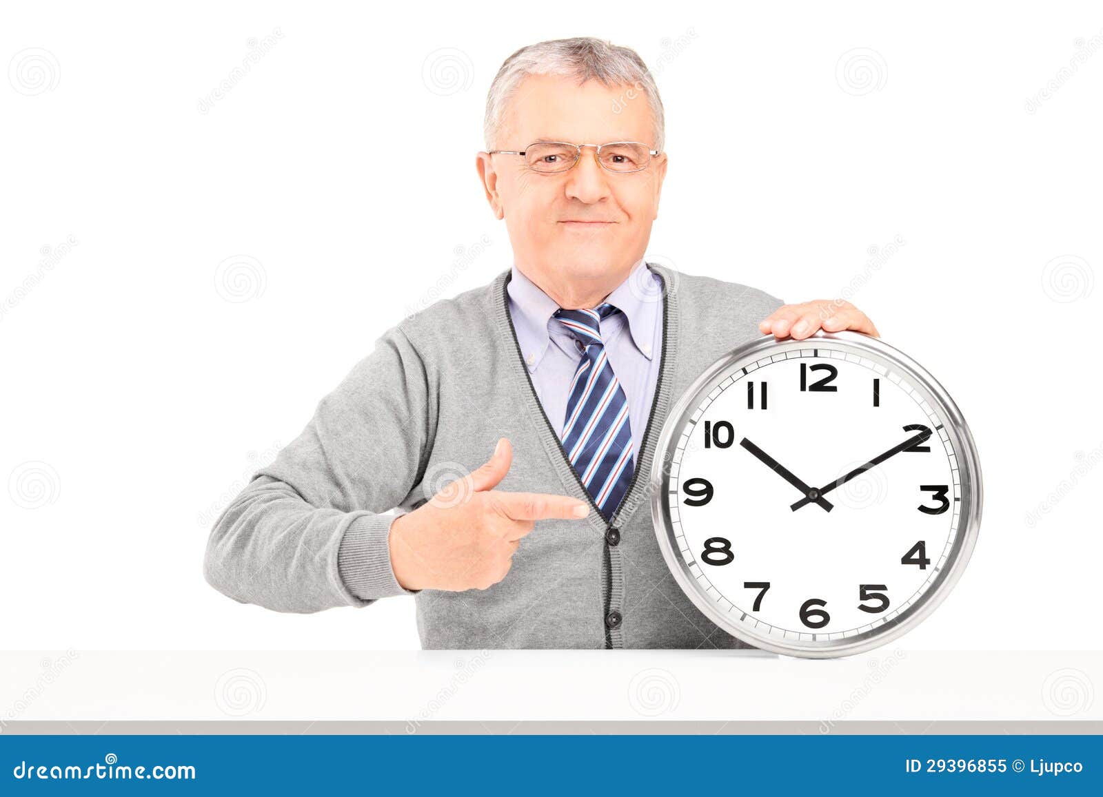 Mature Man Sitting and Pointing on a Wall Clock Stock Image - Image of ...