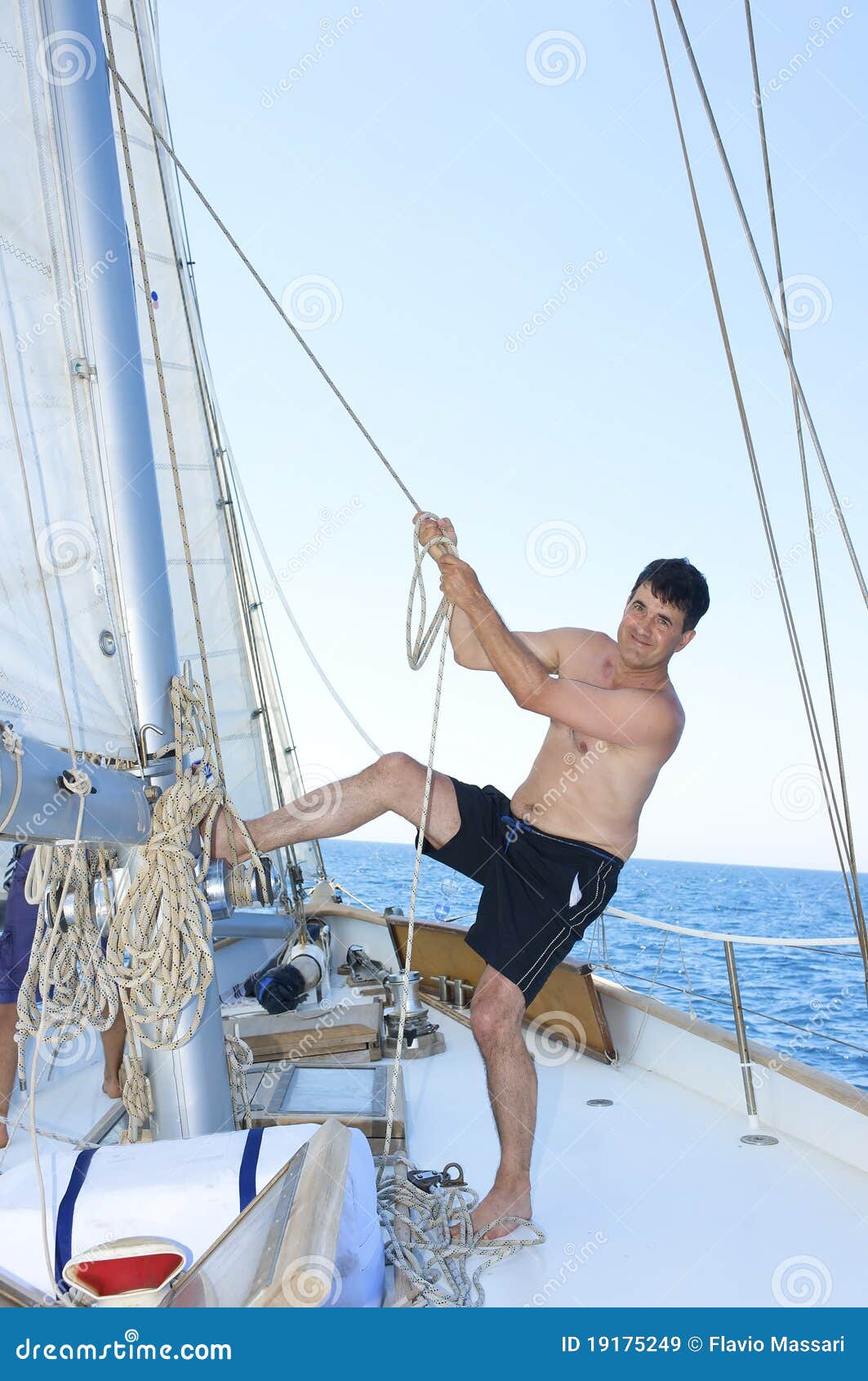 Mature Man Smiling while Hoisting the Sail Stock Image - Image of ...