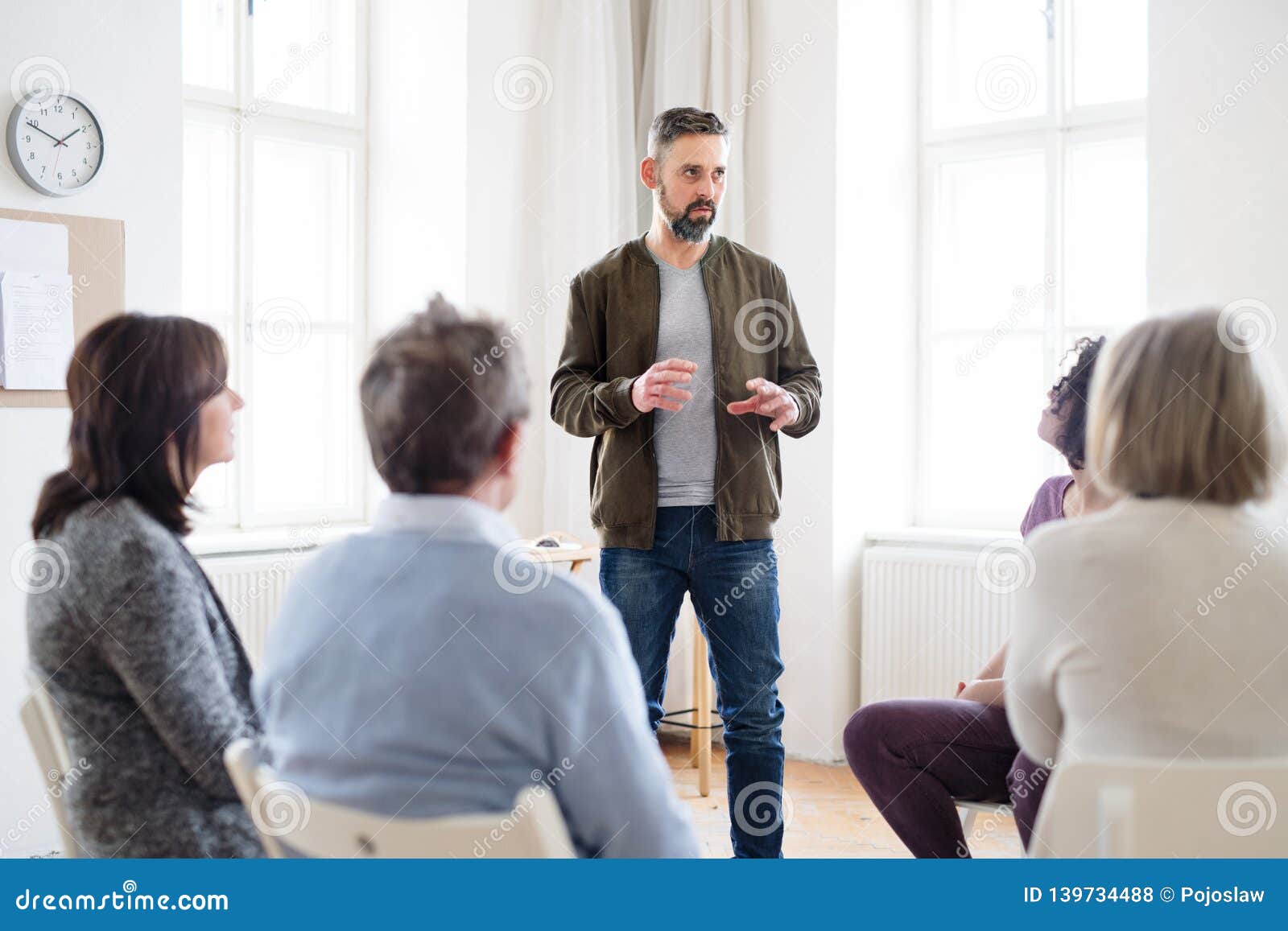 A Man Talking To Other People during Group Therapy. Stock Photo - Image ...
