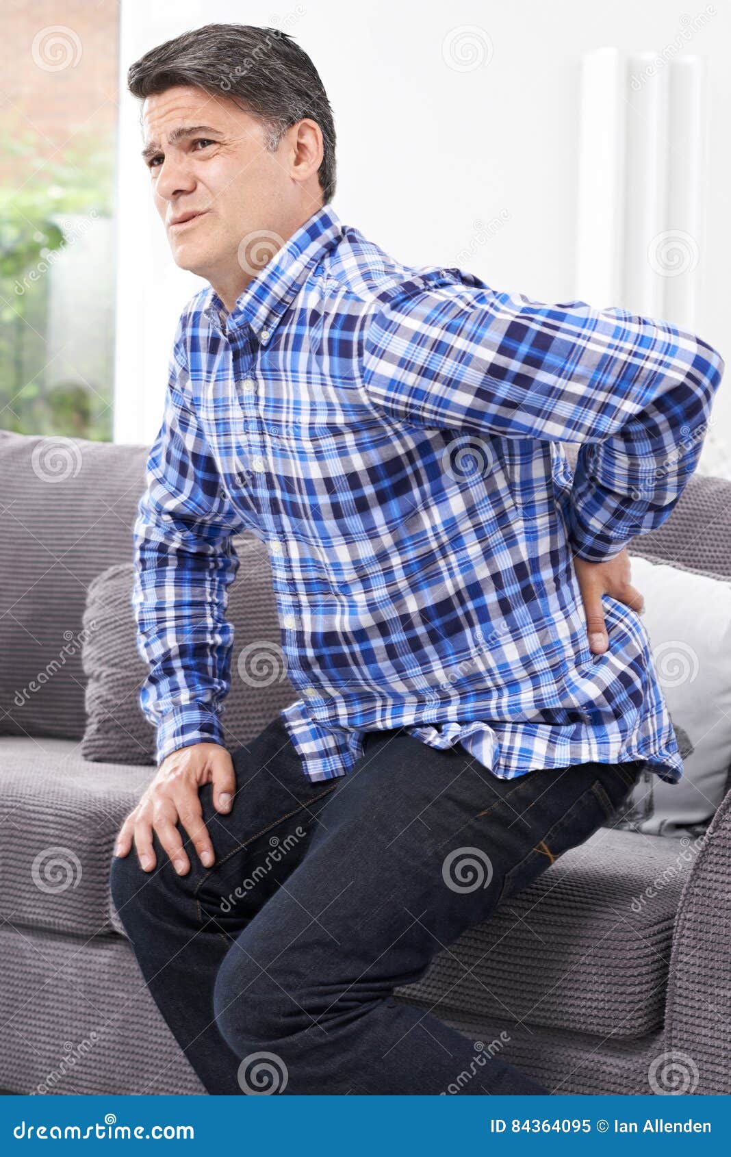 Mature Man Suffering from Backache at Home Stock Image - Image of sofa ...