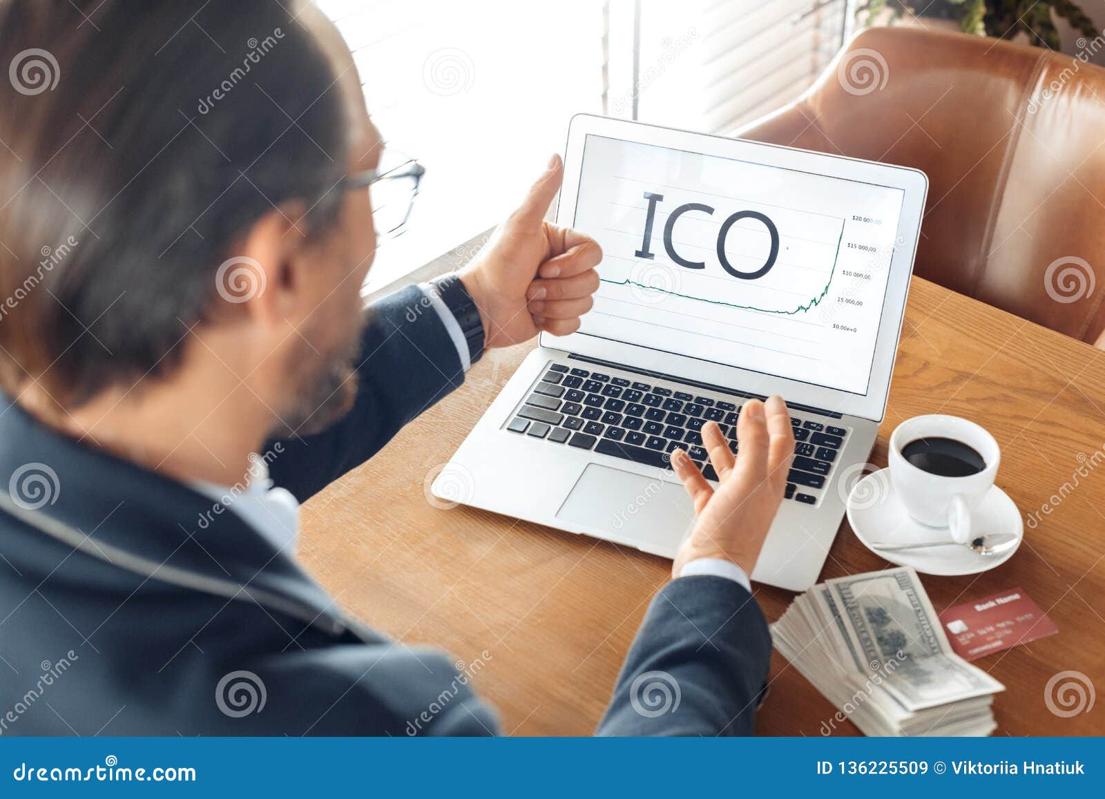 Business Lifestyle. Trader Sitting at Cafe with Coffee and Laptop Using ...