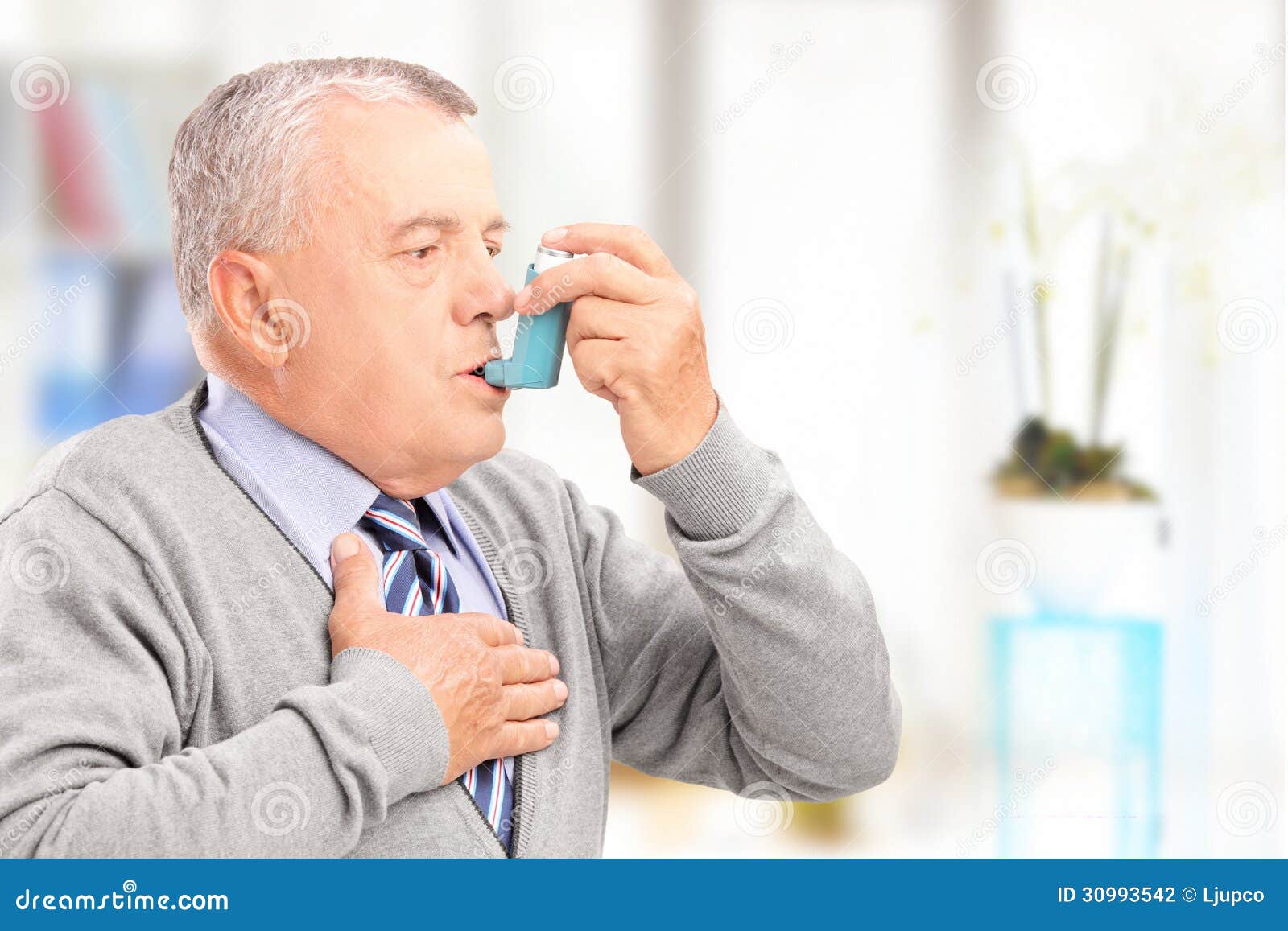 Mature Man Treating Asthma with Inhaler Stock Photo - Image of holding ...