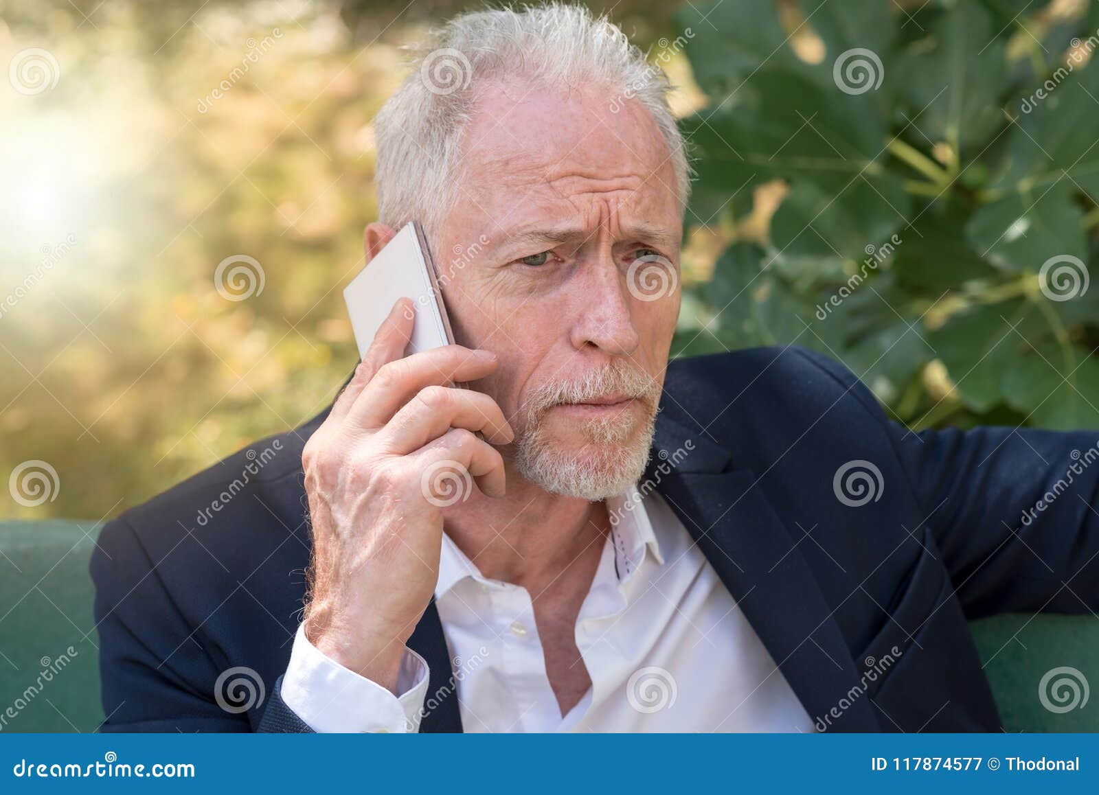 Mature Man Using His Mobile Phone, Light Effect Stock Image - Image of ...