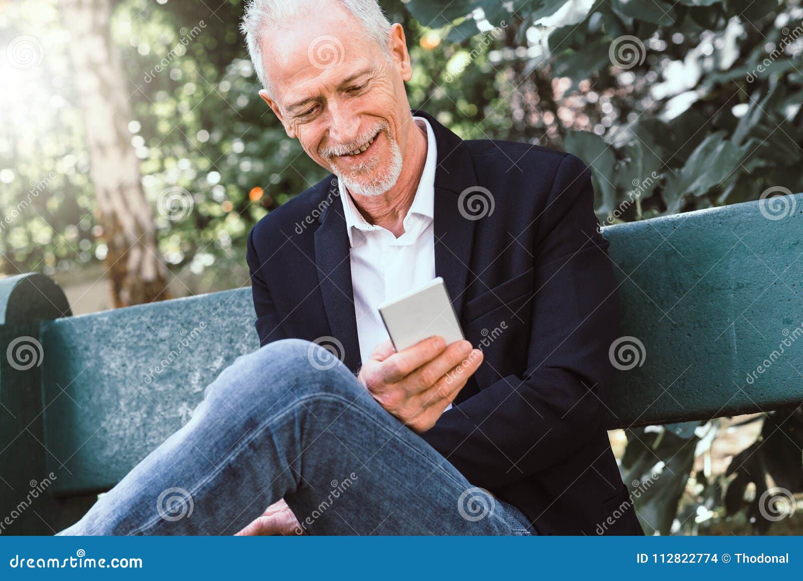 Mature Man Using His Mobile Phone, Light Effect Stock Photo - Image of ...