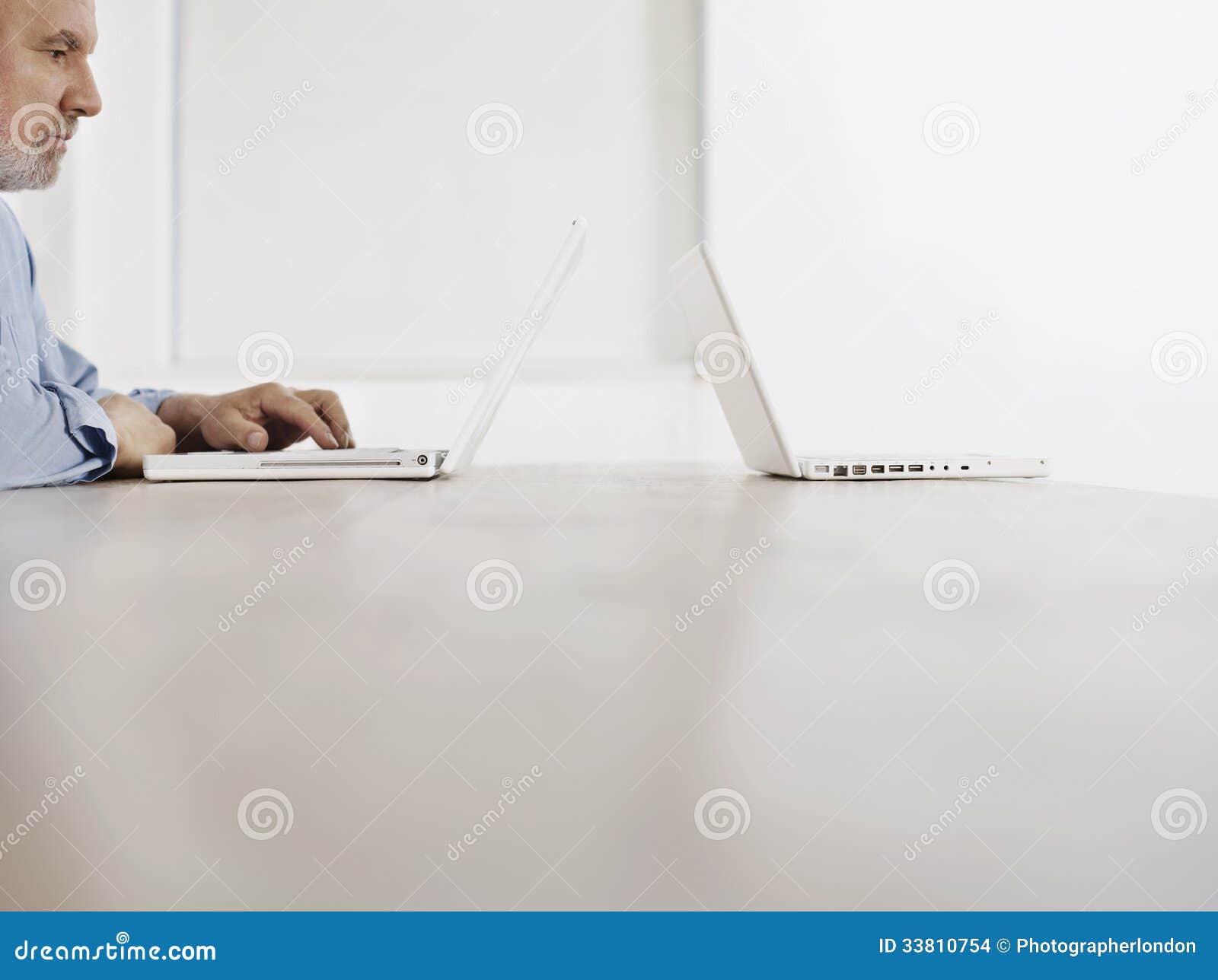 Mature Man Using Laptop at Table Stock Photo - Image of online, cropped ...