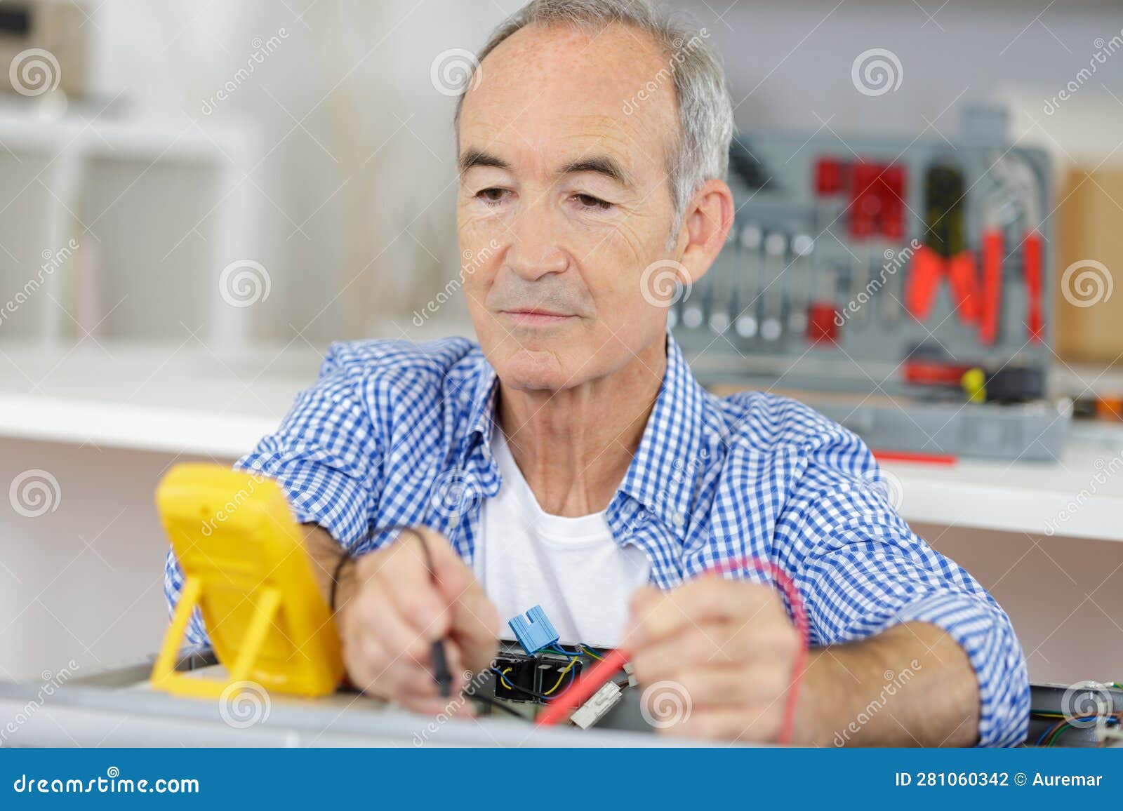 Mature Man Using Multimeter Stock Photo - Image of person, probe: 281060342