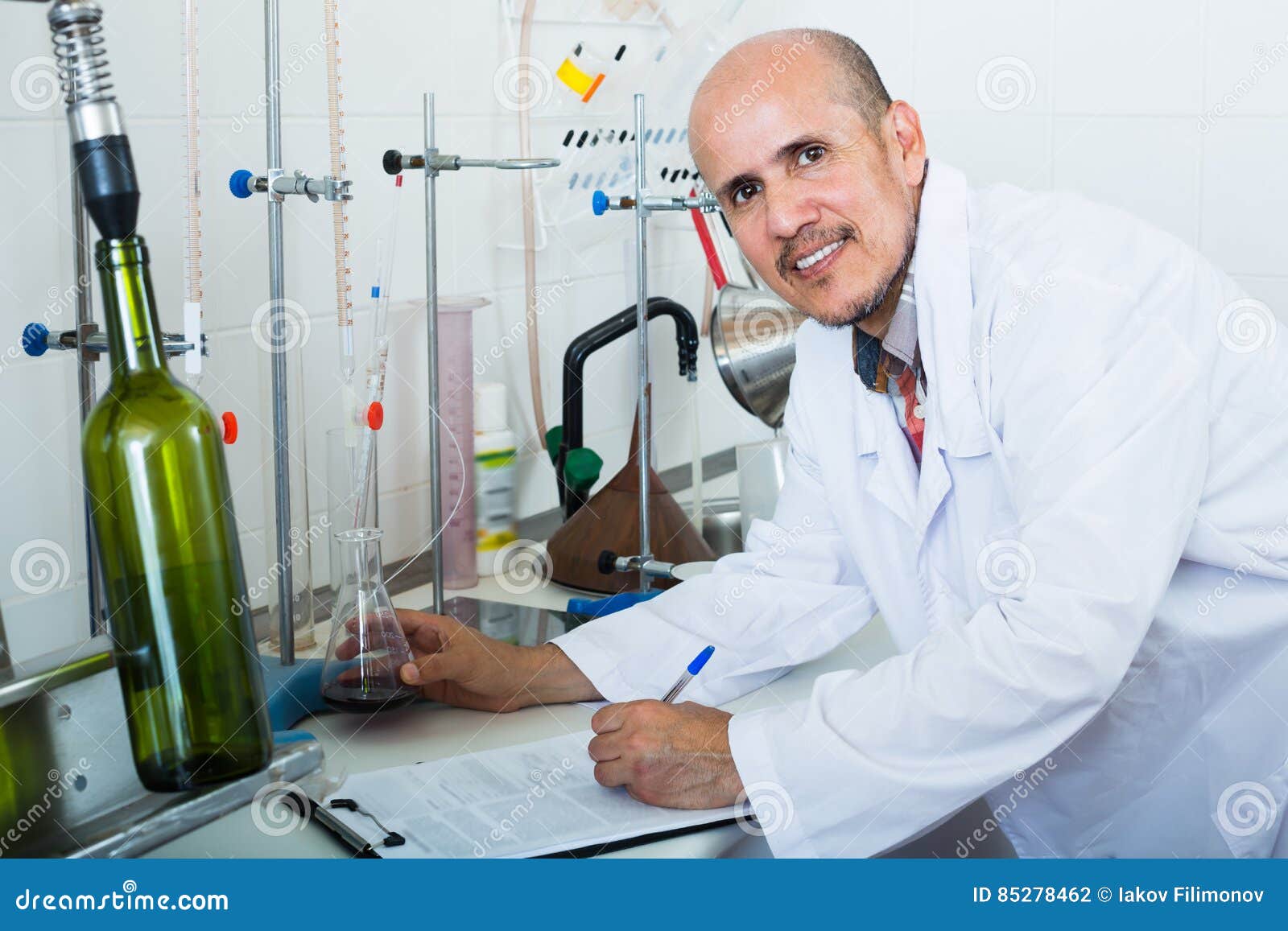 Mature Man in White Coat Making Tests Stock Photo - Image of processing ...