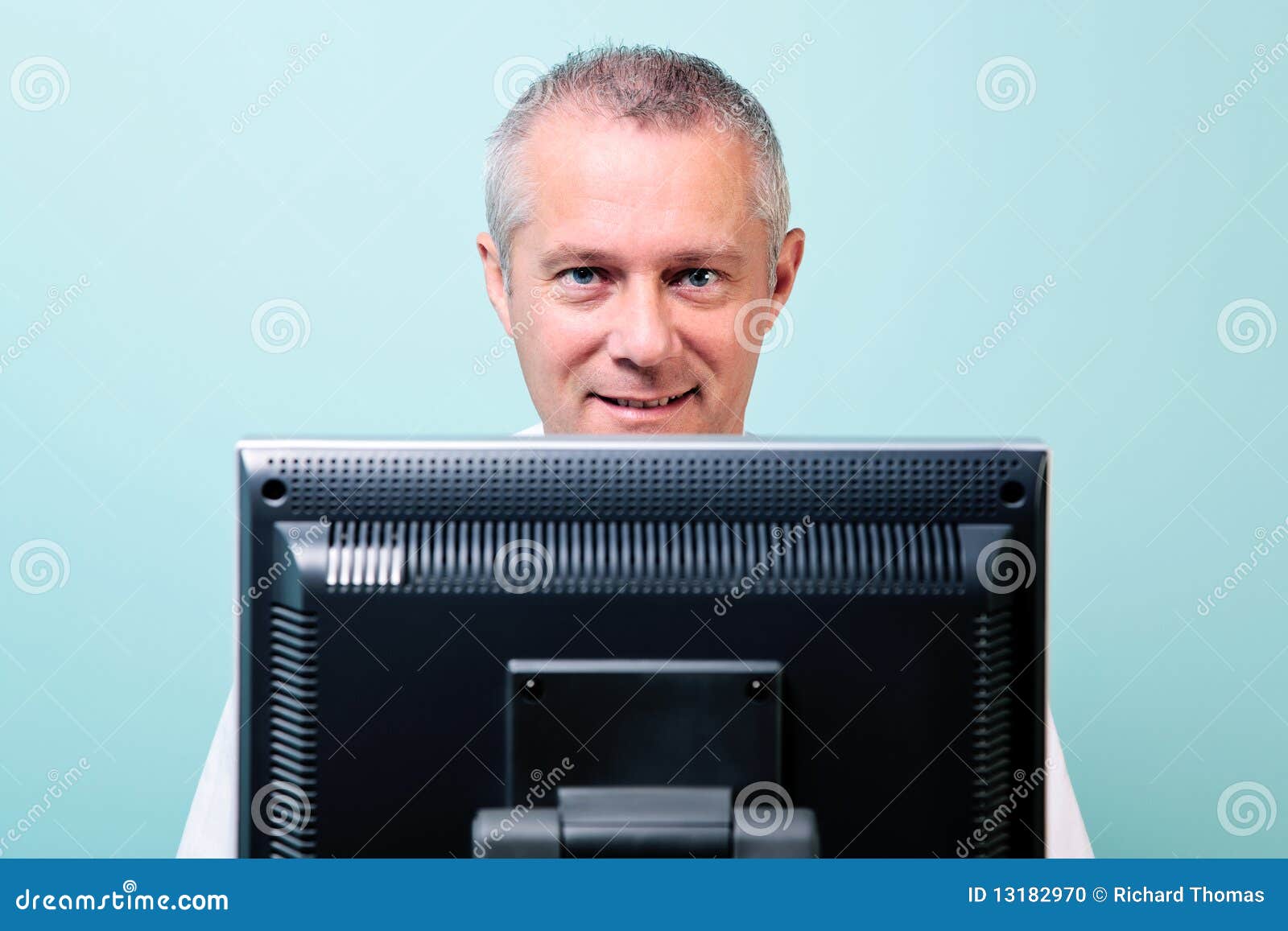 Mature Man Working at a Computer Stock Photo - Image of looking ...