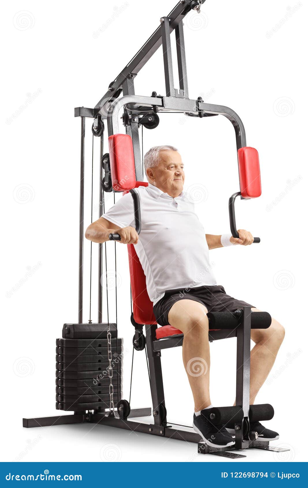 Mature Man Working Out on a Multifunctional Exercise Machine Stock ...