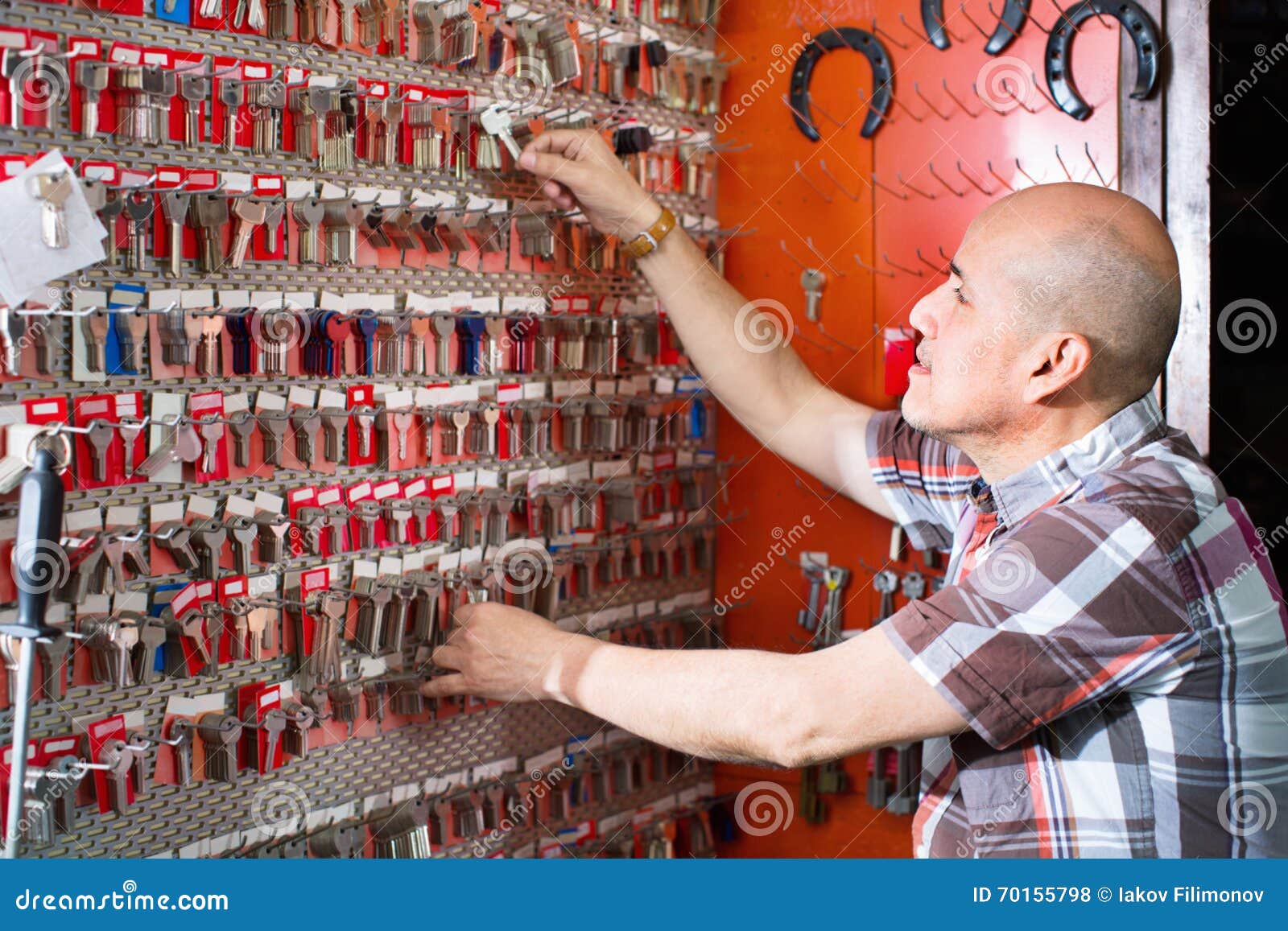 Mature Professional Hanging New Key on Stand Stock Photo - Image of ...
