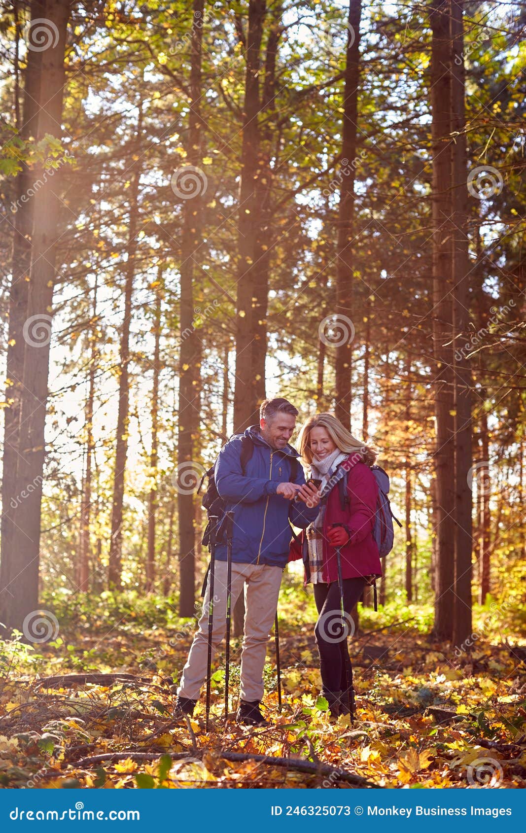 Mature Retired Couple Walk in Fall or Winter Countryside Using Map or ...