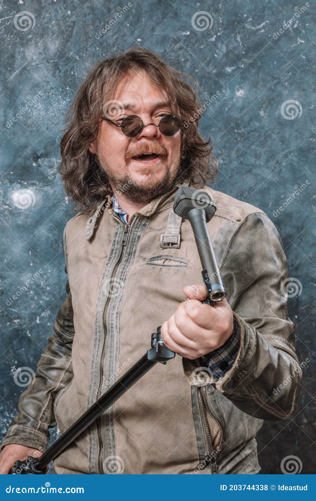 Mature Rocker with Microphone Emotional Studio Portrait. Stock Photo ...