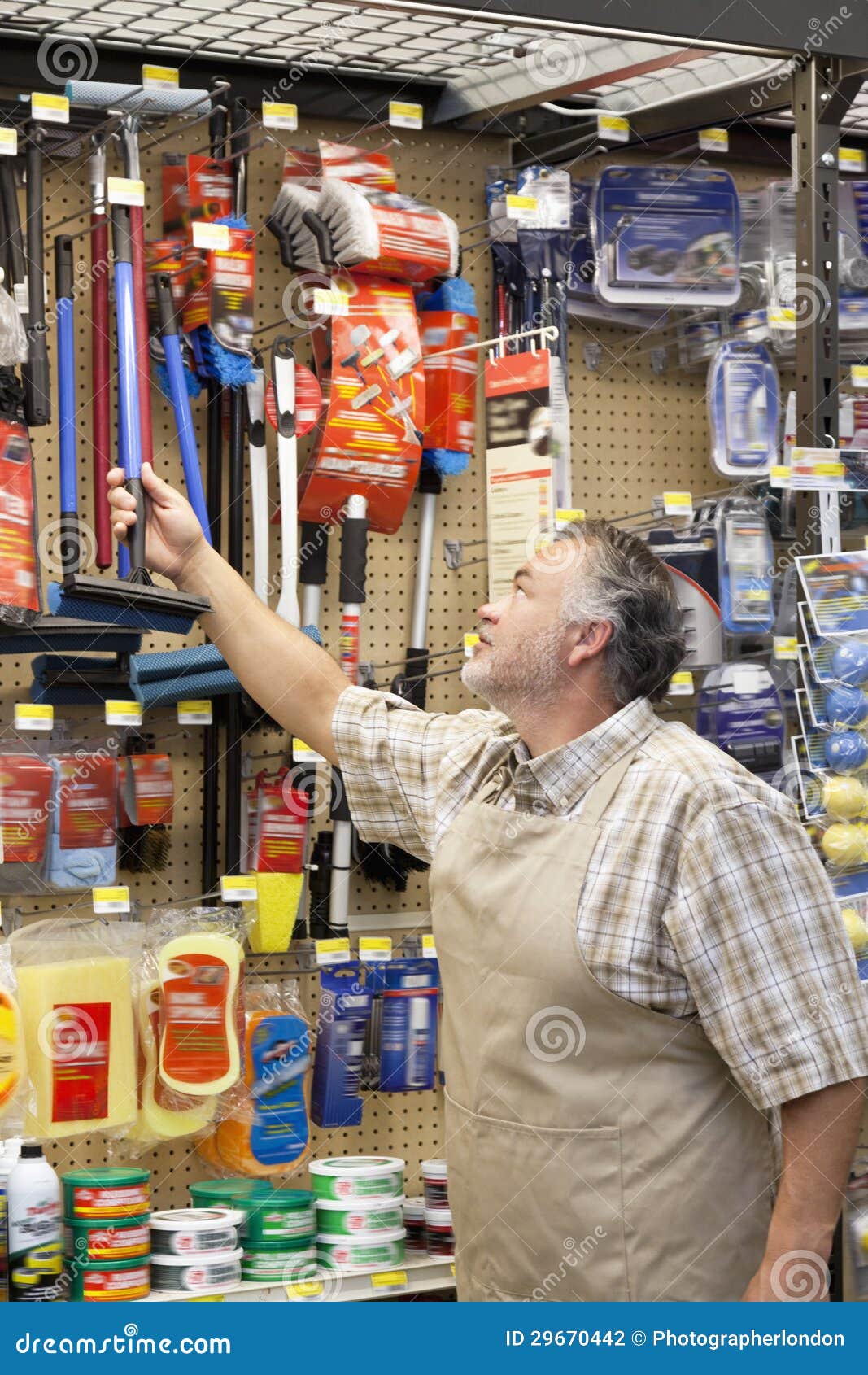 Mature Salesperson Working in Hardware Store Editorial Photography ...