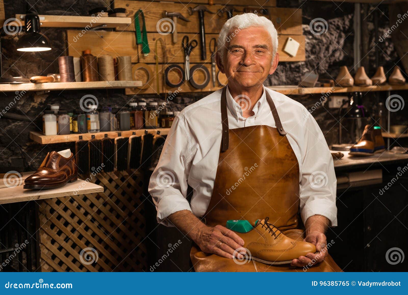 Mature Smiling Shoemaker in Workshop Holding Shoes Stock Image - Image ...