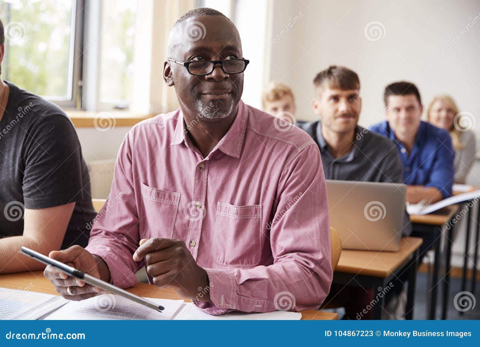 Mature Student Using Digital Tablet in Adult Education Class Stock ...