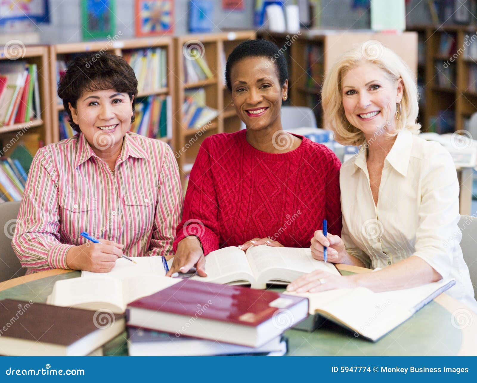 Mature Students Studying in Library Stock Photo - Image of camera ...