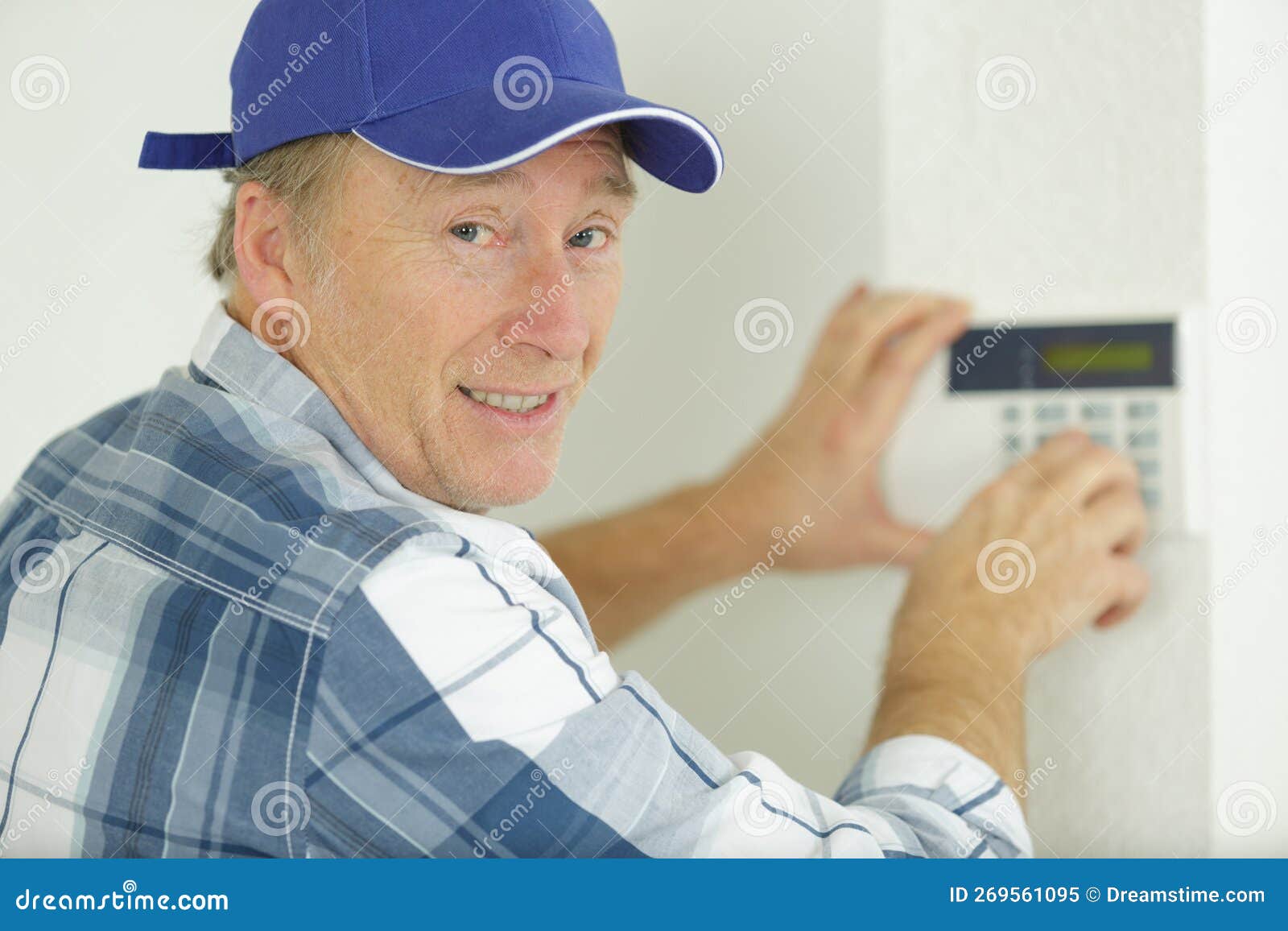 Mature Technician Programming Keypad Stock Image - Image of serviceman ...