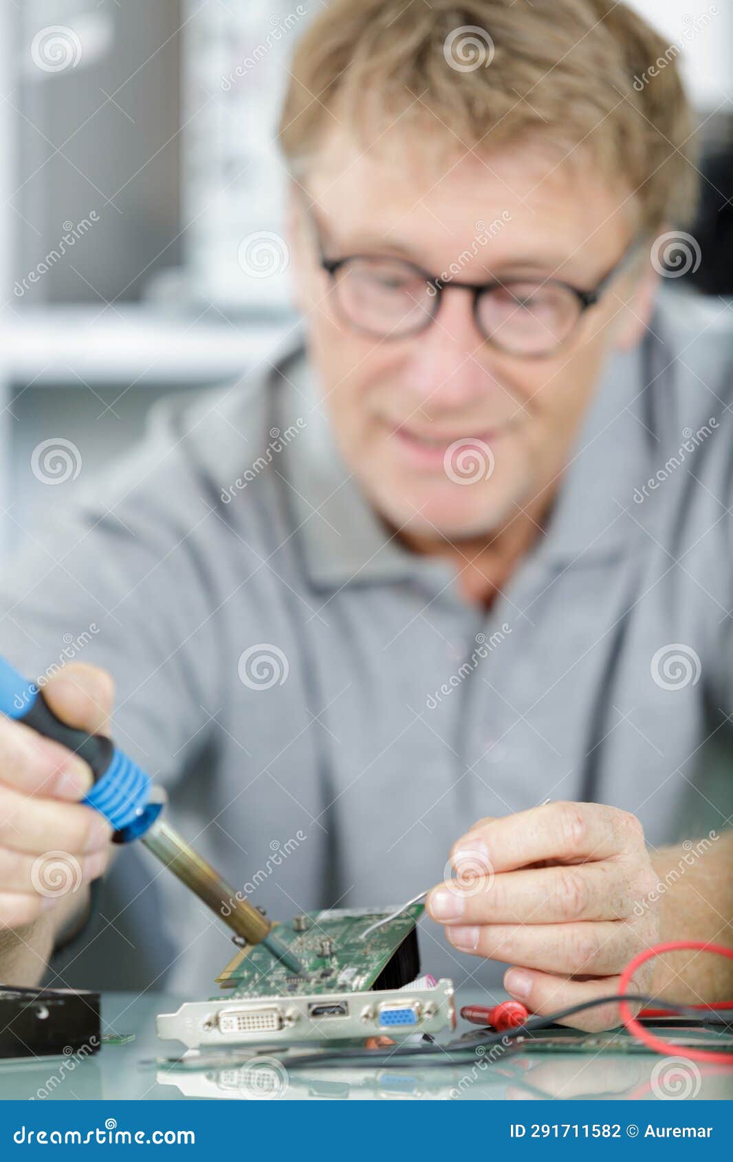 Technician Use Soldering Iron To Solder Metal And Wire Of Lithium-ion ...