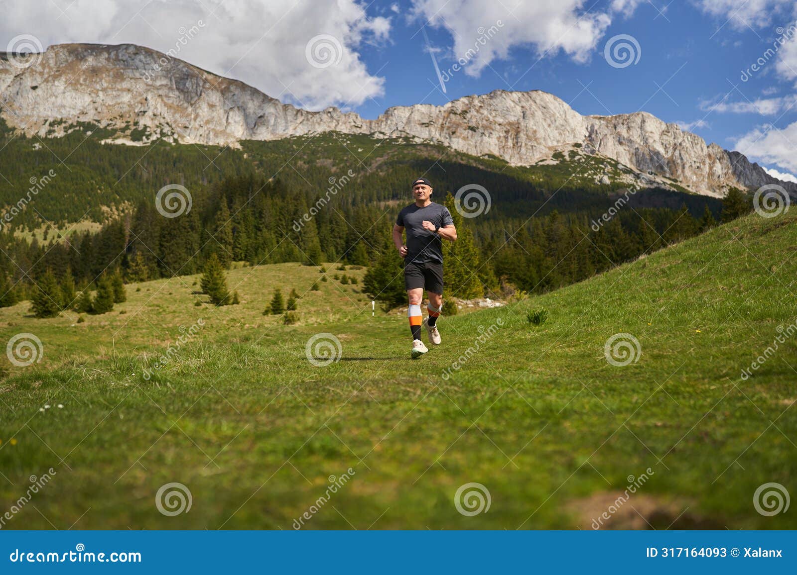 Mature Trail Runner in the Mountains Stock Image - Image of grass ...