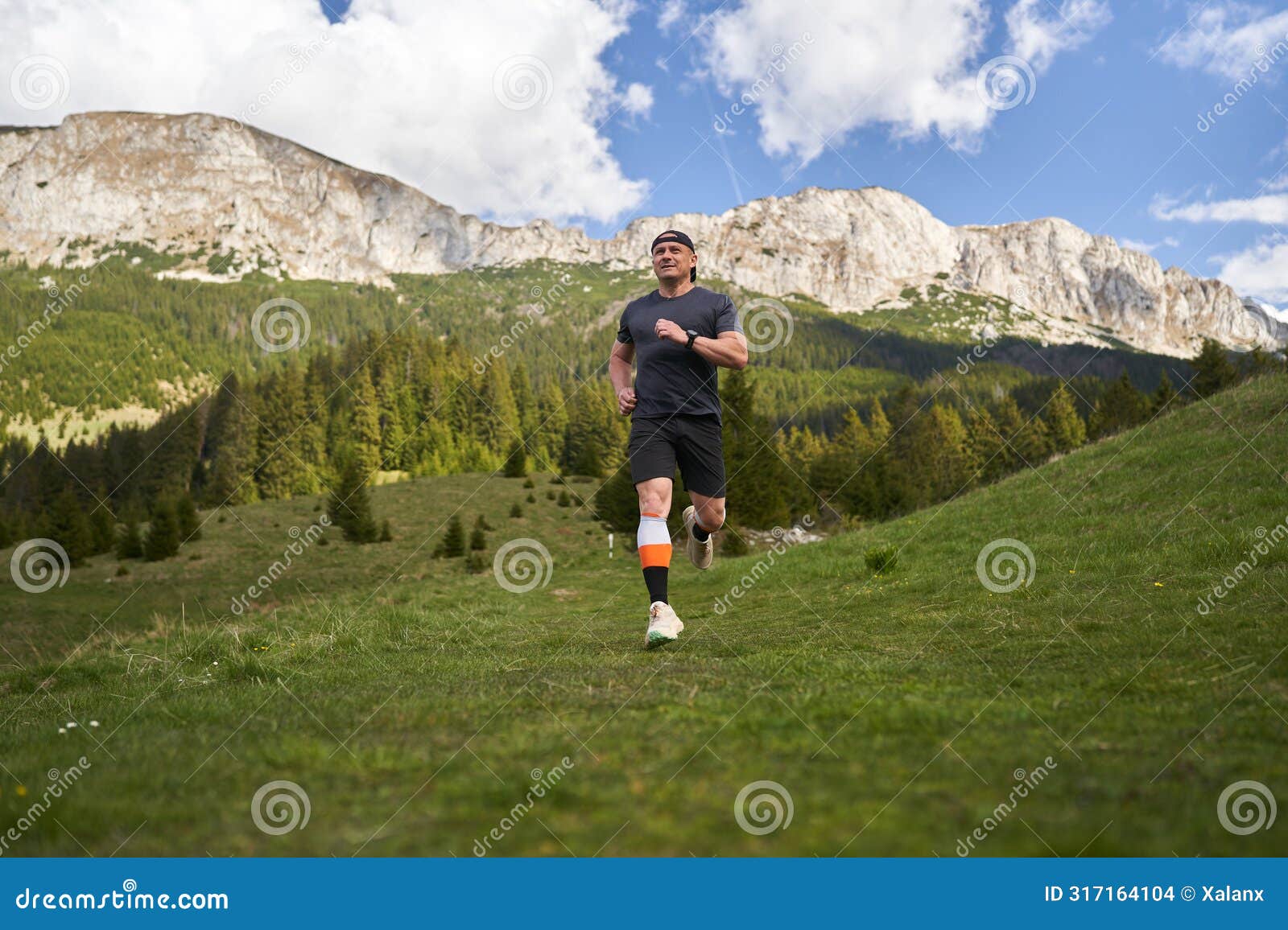 Mature Trail Runner in the Mountains Stock Photo - Image of hills ...