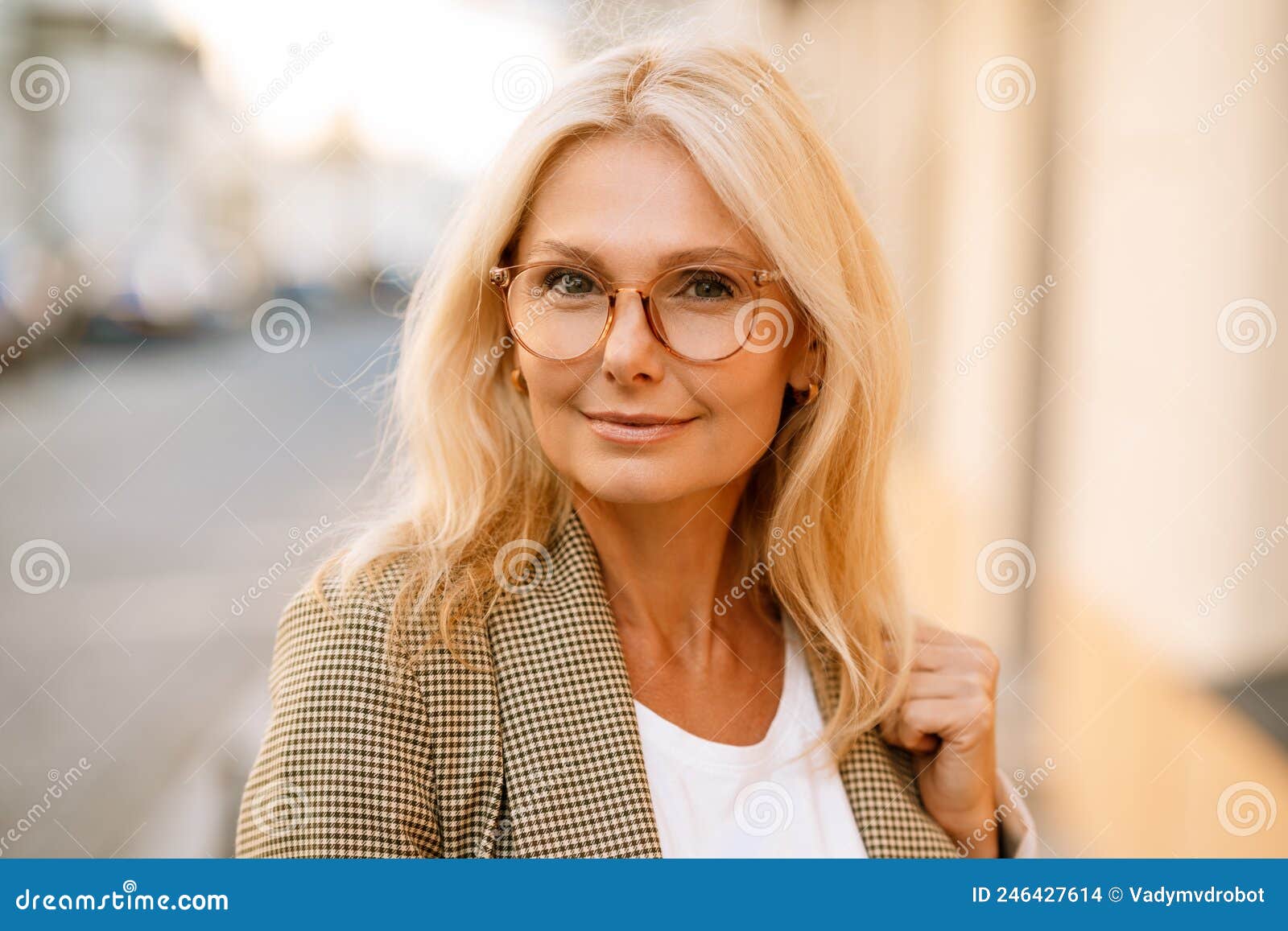 Mature White Woman Wearing Eyeglasses Smiling And Looking At Camera