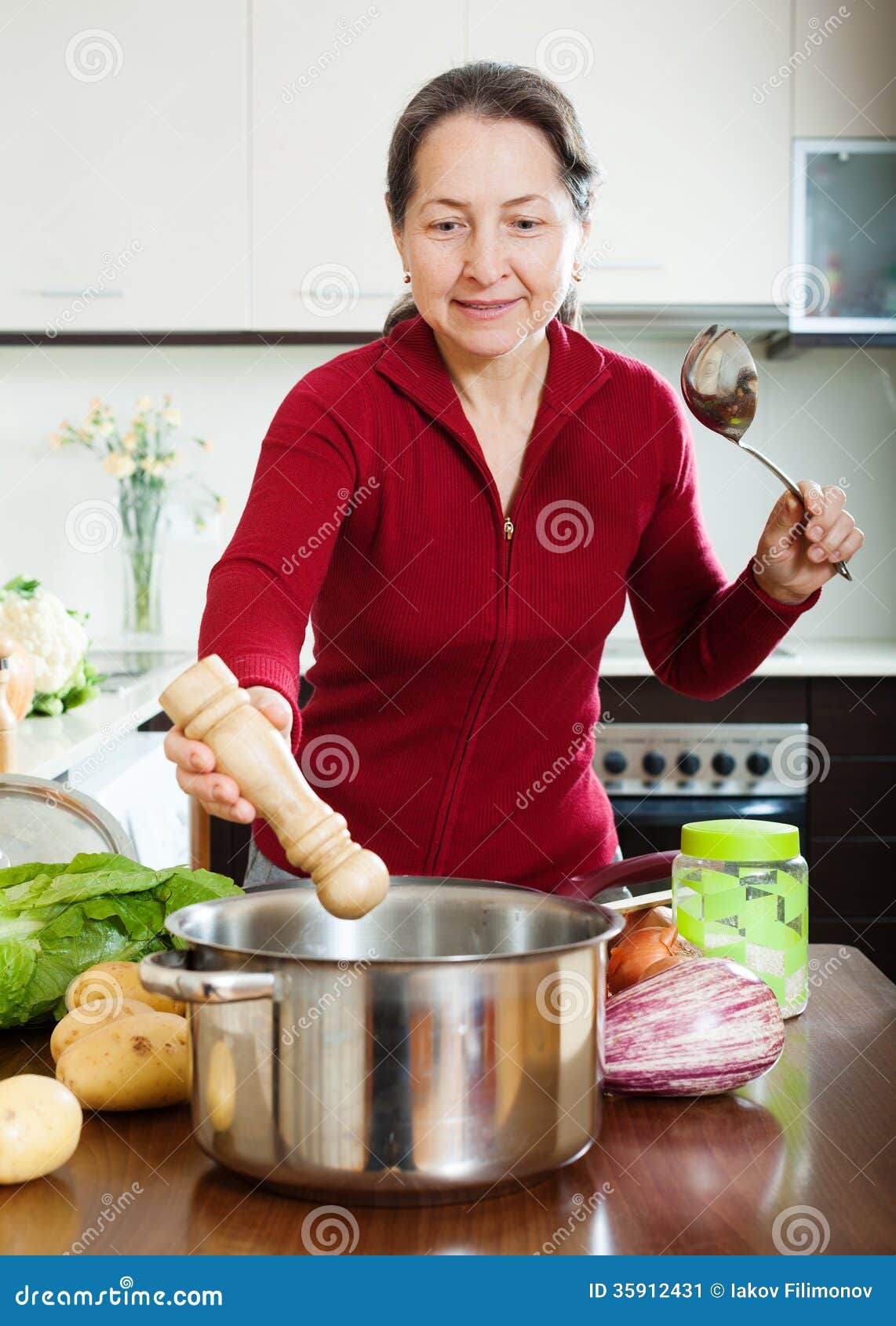 Mature Woman Adding Seasoning into Pan Stock Image - Image of nutrition ...