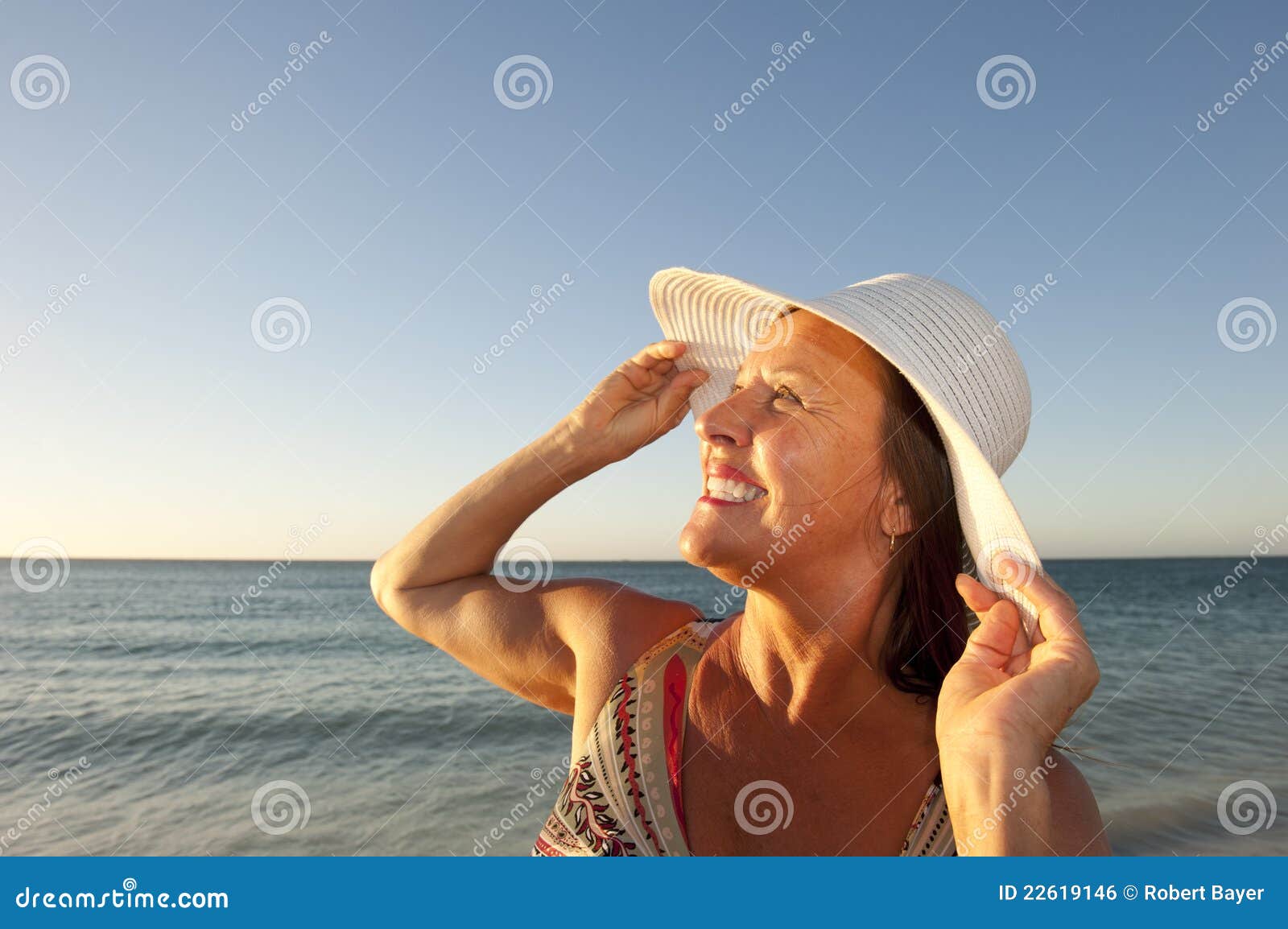 Mature Woman Beach at Sunset Stock Photo - Image of dress, happiness ...