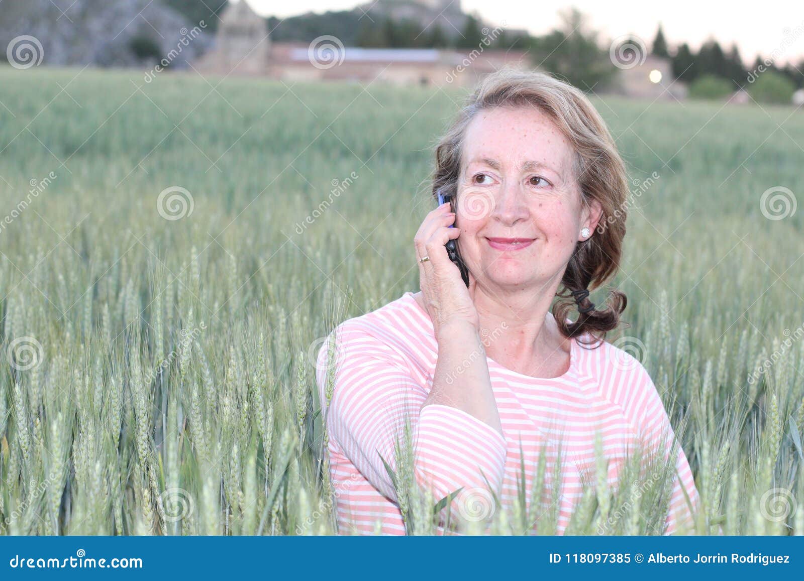 Mature Woman Calling by Cellphone in Nature Stock Image - Image of ...