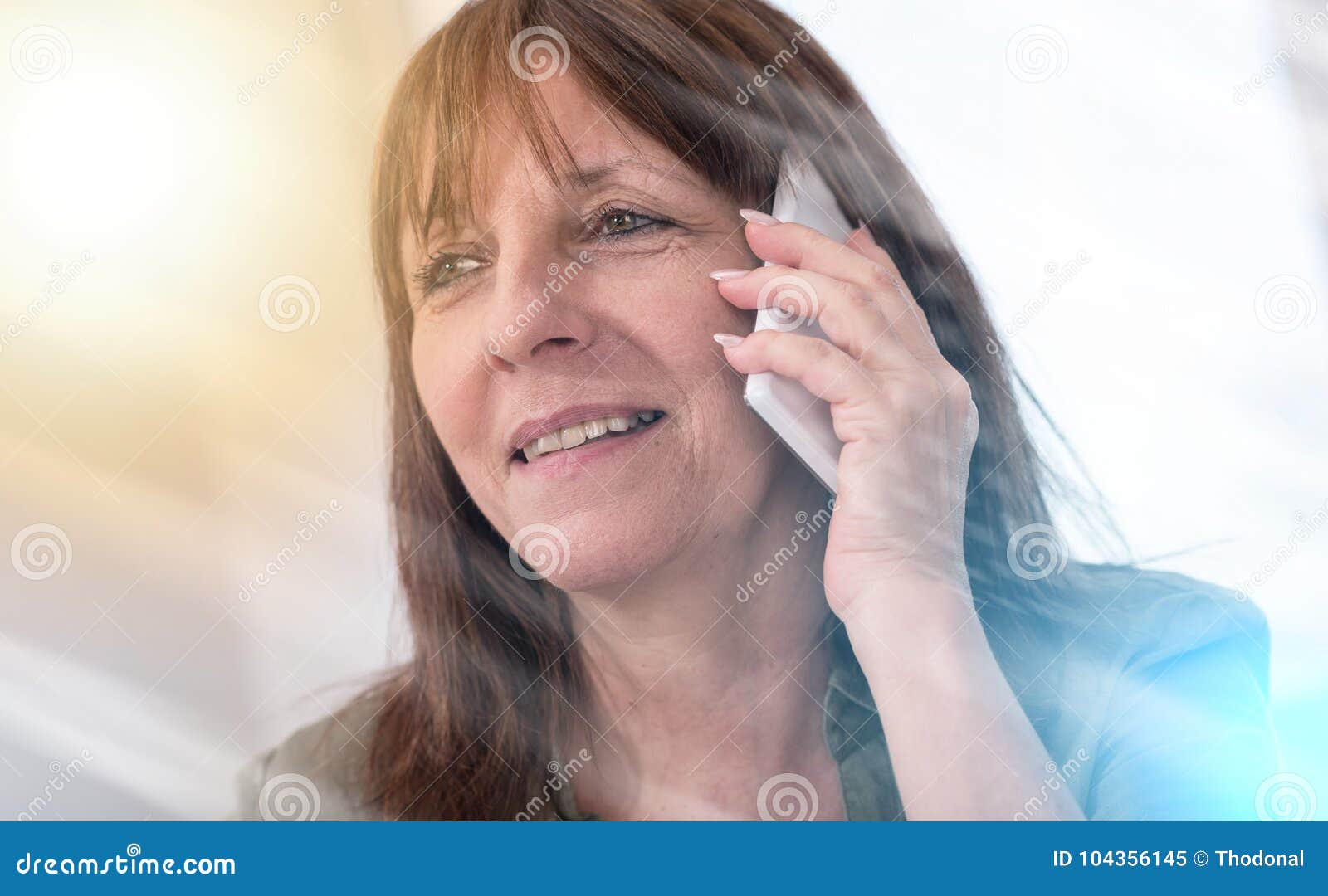 Mature Woman Calling on Mobile Phone, Light Effect Stock Image - Image ...