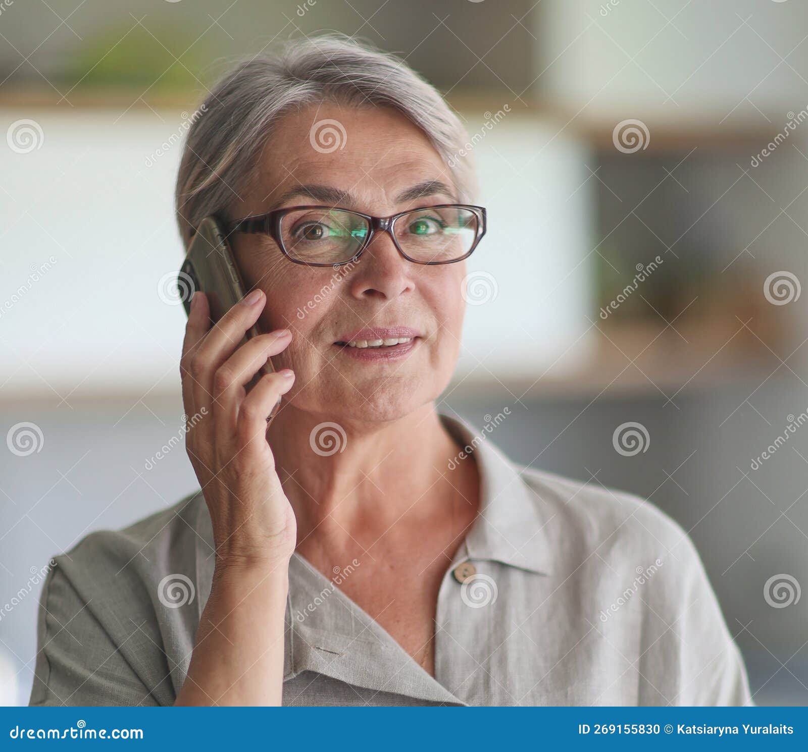Mature Woman Calling on the Phone in the Office Stock Photo - Image of ...