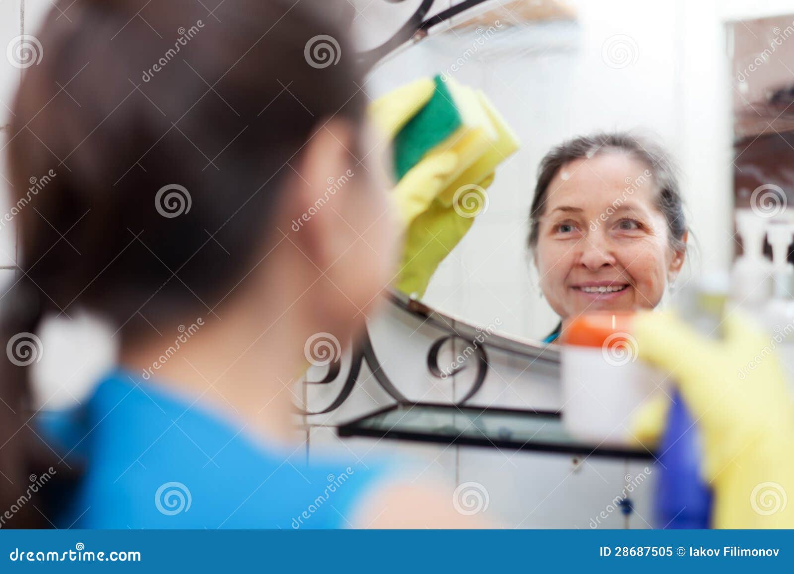 Mature Woman Cleans Mirror with Sponge Stock Image - Image of house ...
