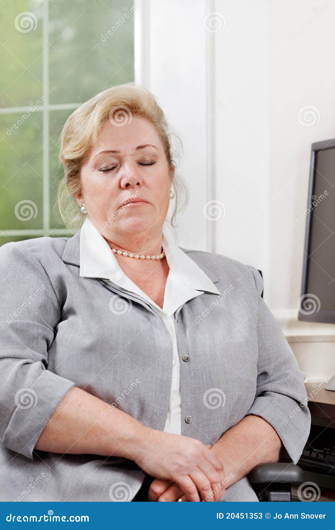 Mature Woman Dozing at the Desk Stock Image - Image of serious, blond ...