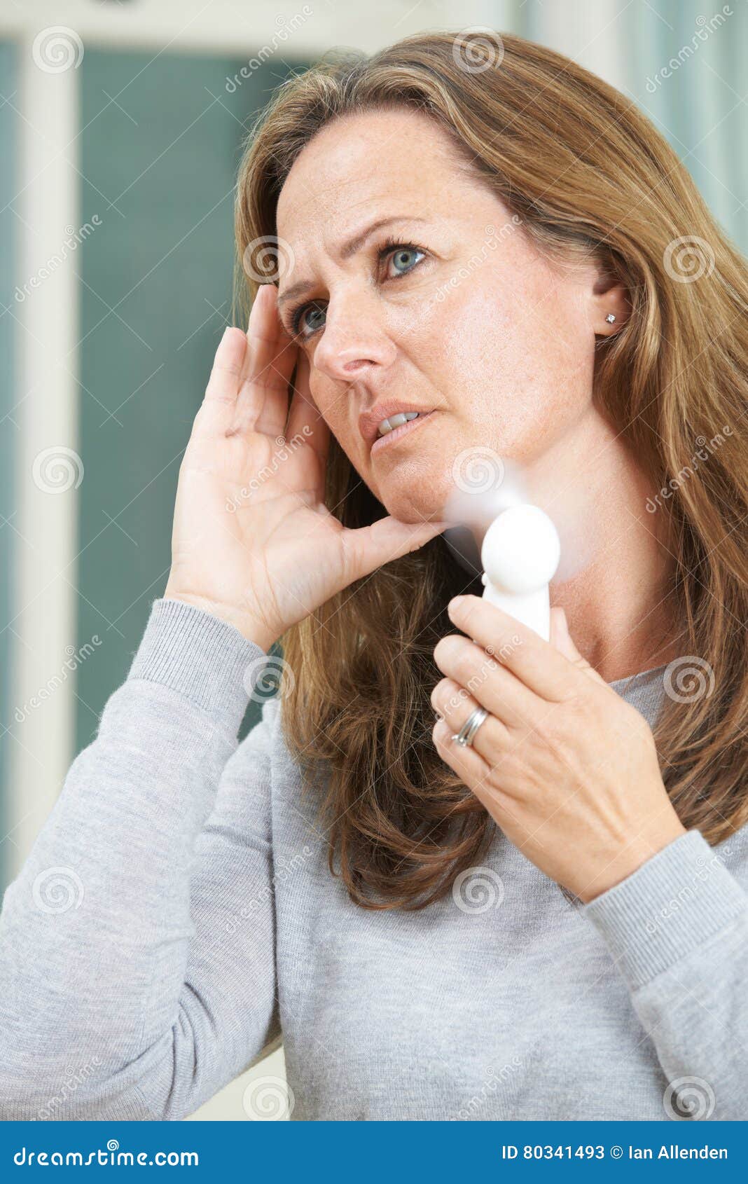 Mature Woman Experiencing Hot Flush from Menopause Stock Image - Image ...