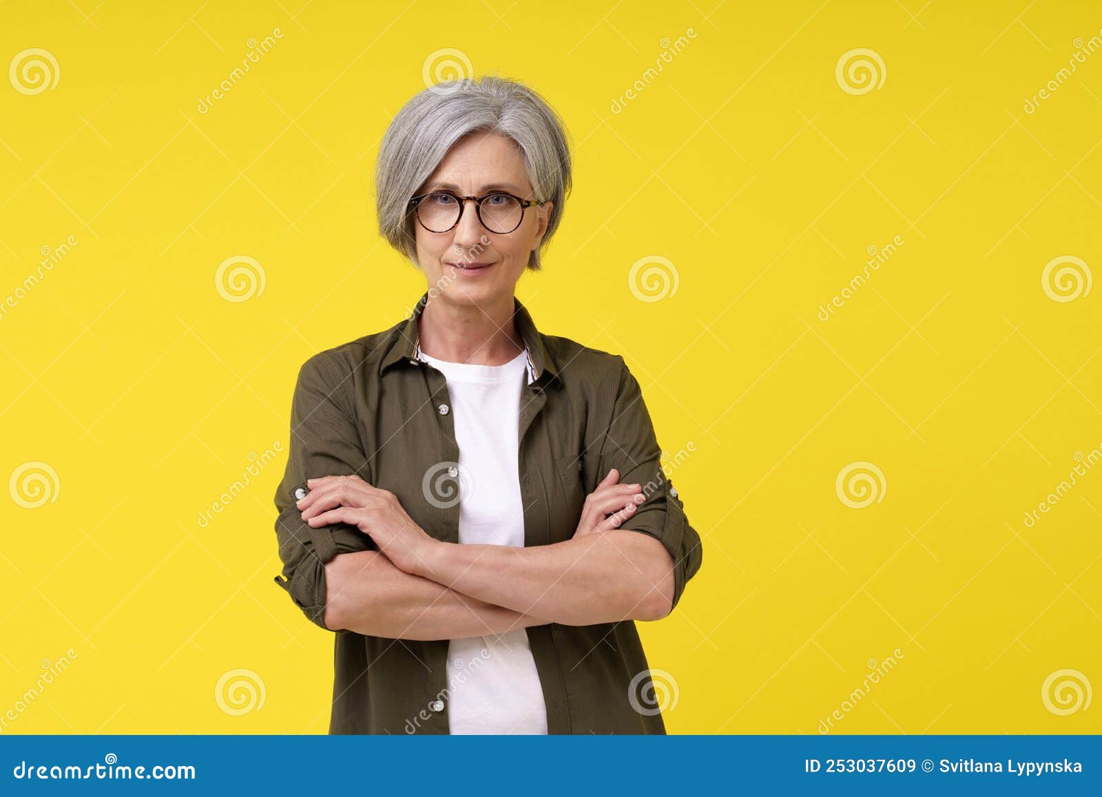Mature Woman In Her 50s Serious Businesswoman With Folded Hands