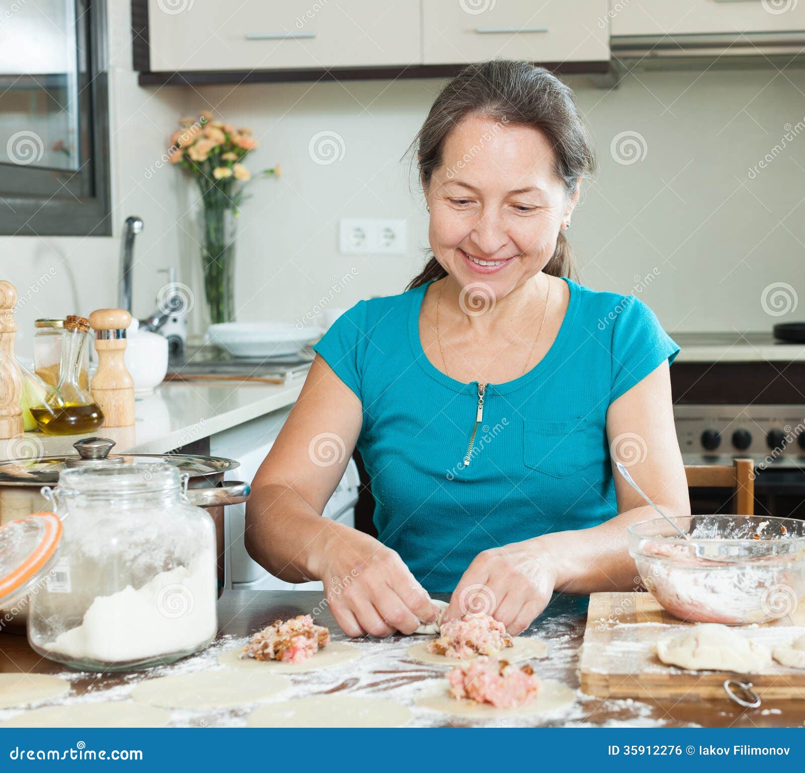 Mature Woman Making Dumplings Stock Photo - Image of dough, pelmeni ...