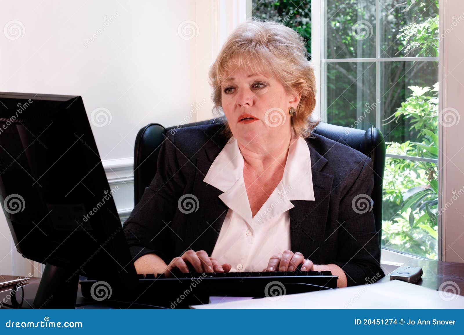 Mature Woman in Office Typing Stock Photo - Image of older, lady: 20451274