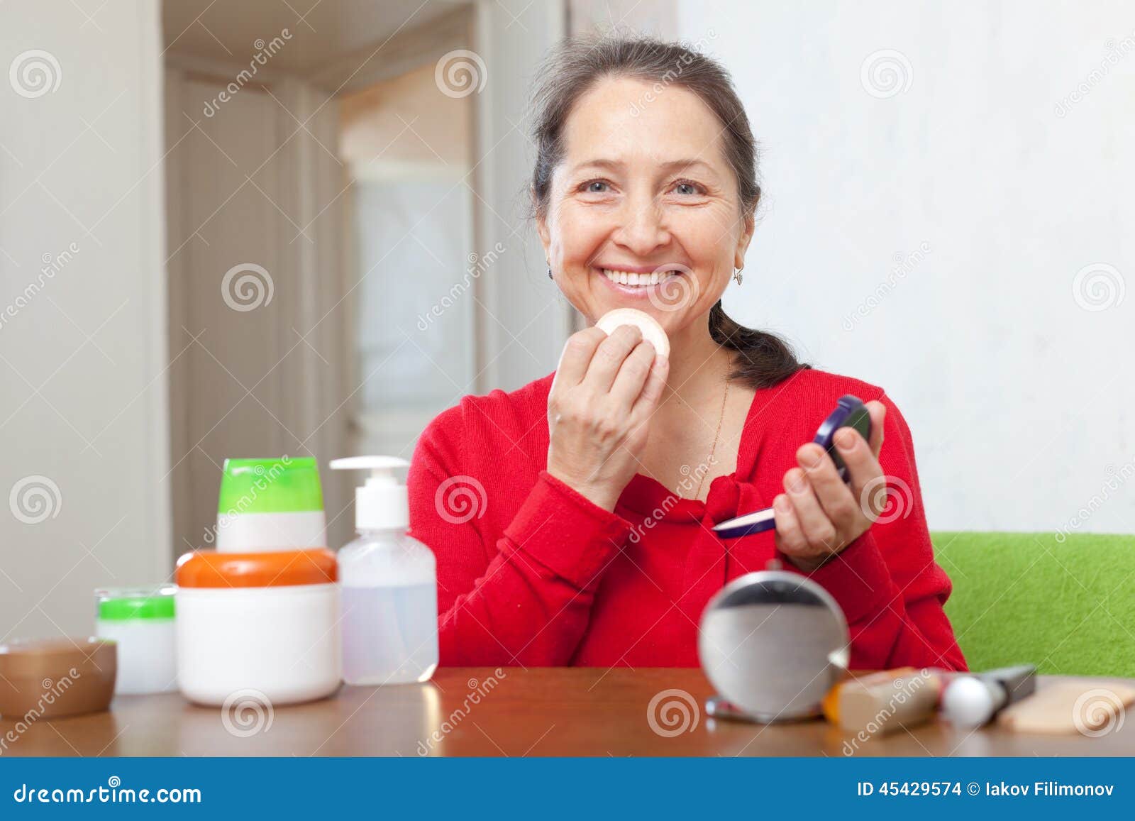 Mature Woman Putting Facepowder on Face Stock Photo - Image of portrait ...